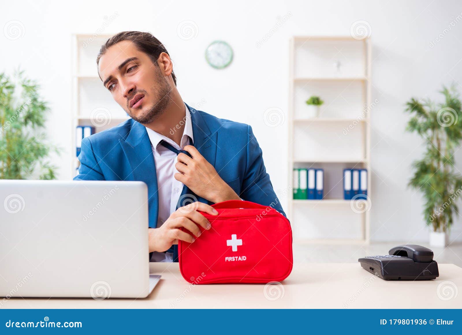 Young Male Employee in First Aid Concept Stock Photo - Image of lawyer ...