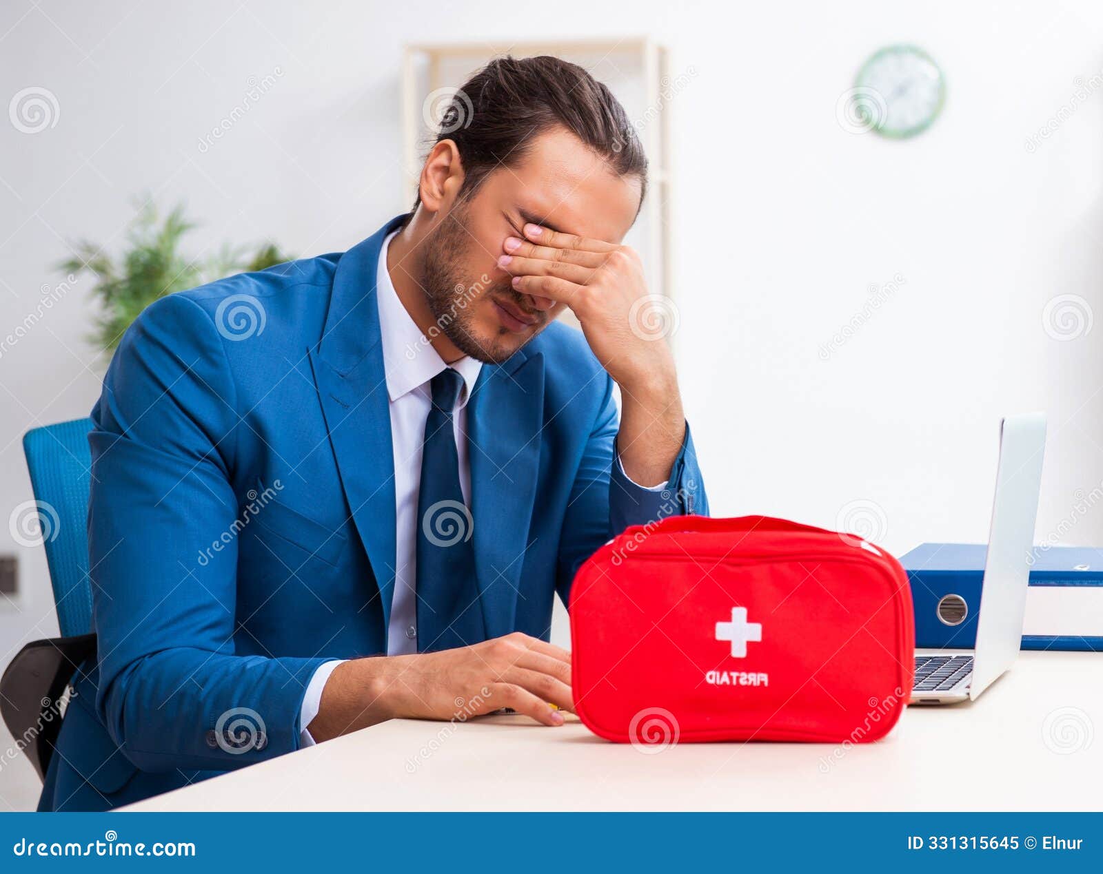 Young Male Employee in First Aid Concept Stock Image - Image of ...