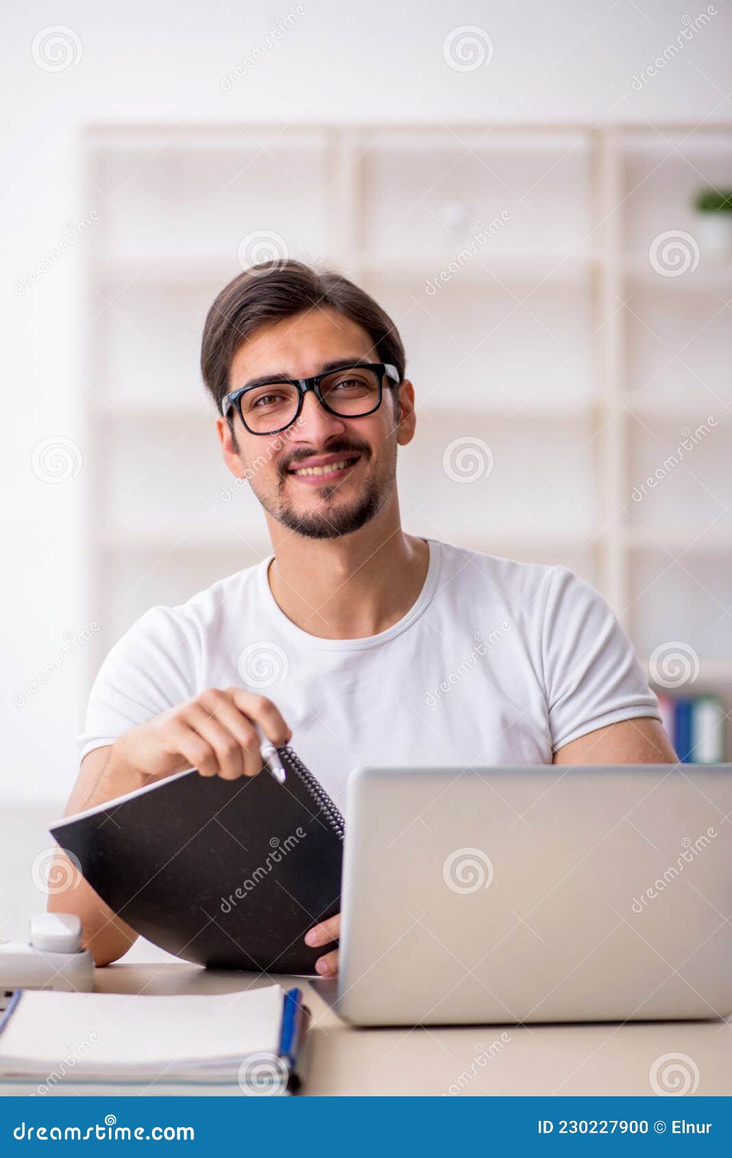 Young Male Employee Freelancer Sitting in the Office Stock Photo ... Young Male Employee Freelancer Sitting in the Office Stock Photo ...