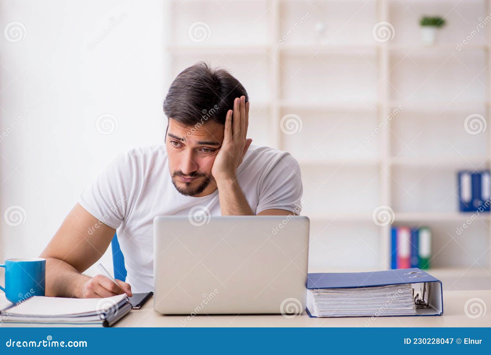Young Male Employee Freelancer Sitting in the Office Stock Image ... Young Male Employee Freelancer Sitting in the Office Stock Image ...