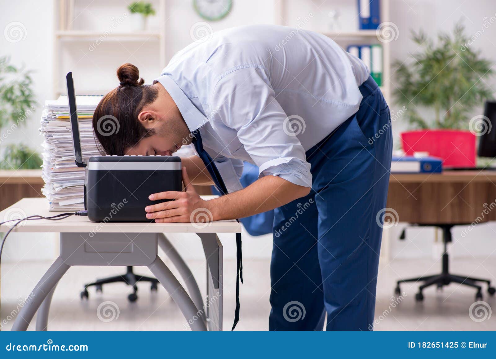 Young Male Employee Making Copies at Copying Machine Stock Image ...