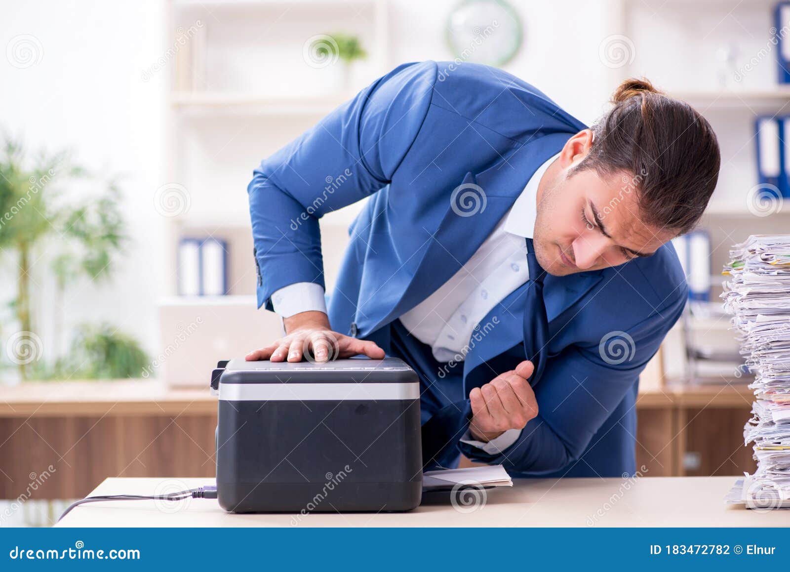Young Male Employee Making Copies at Copying Machine Stock Photo ...