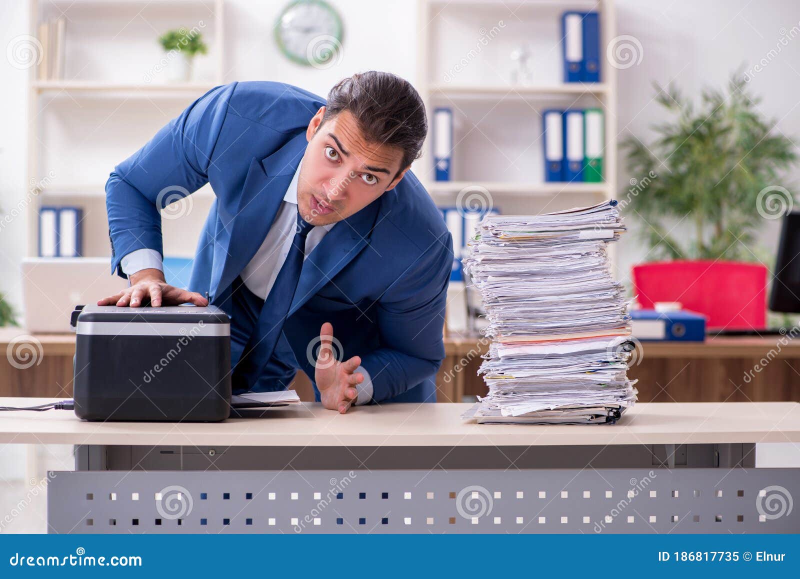 Young Male Employee Making Copies at Copying Machine Stock Image ...