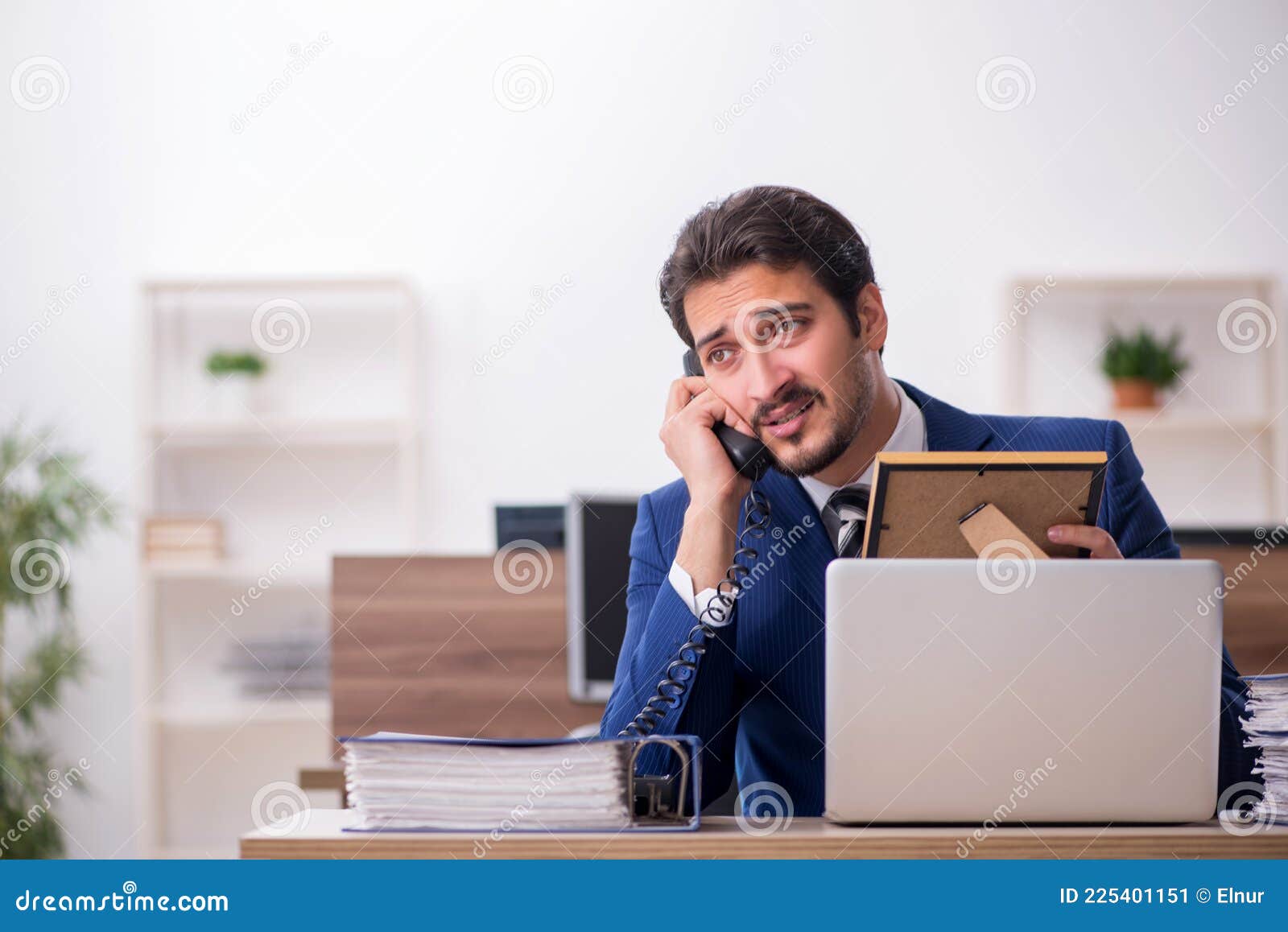 Young Male Employee Missing Girlfriend at Workplace Stock Image - Image ...