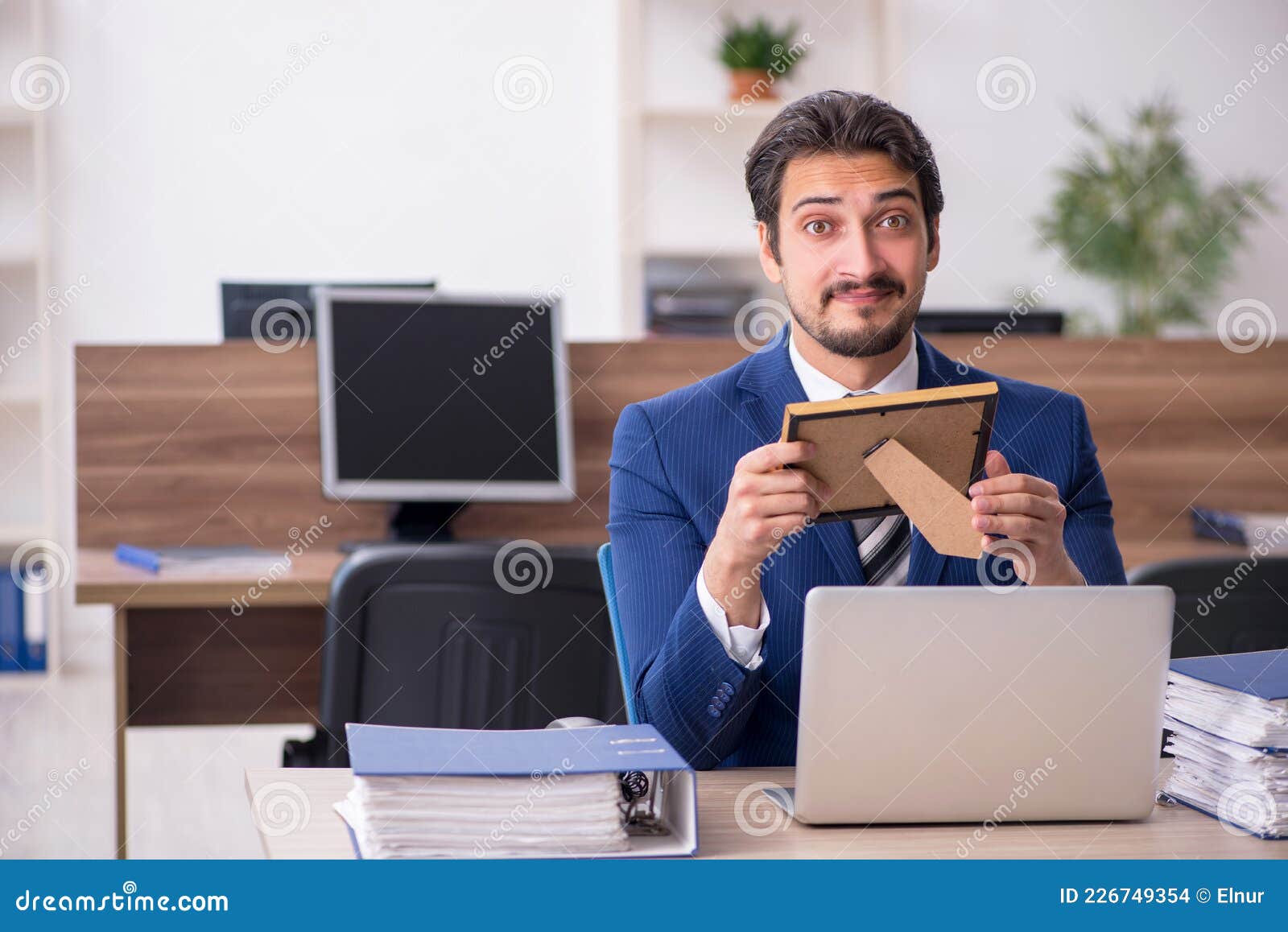 Young Male Employee Missing Girlfriend at Workplace Stock Photo - Image ...