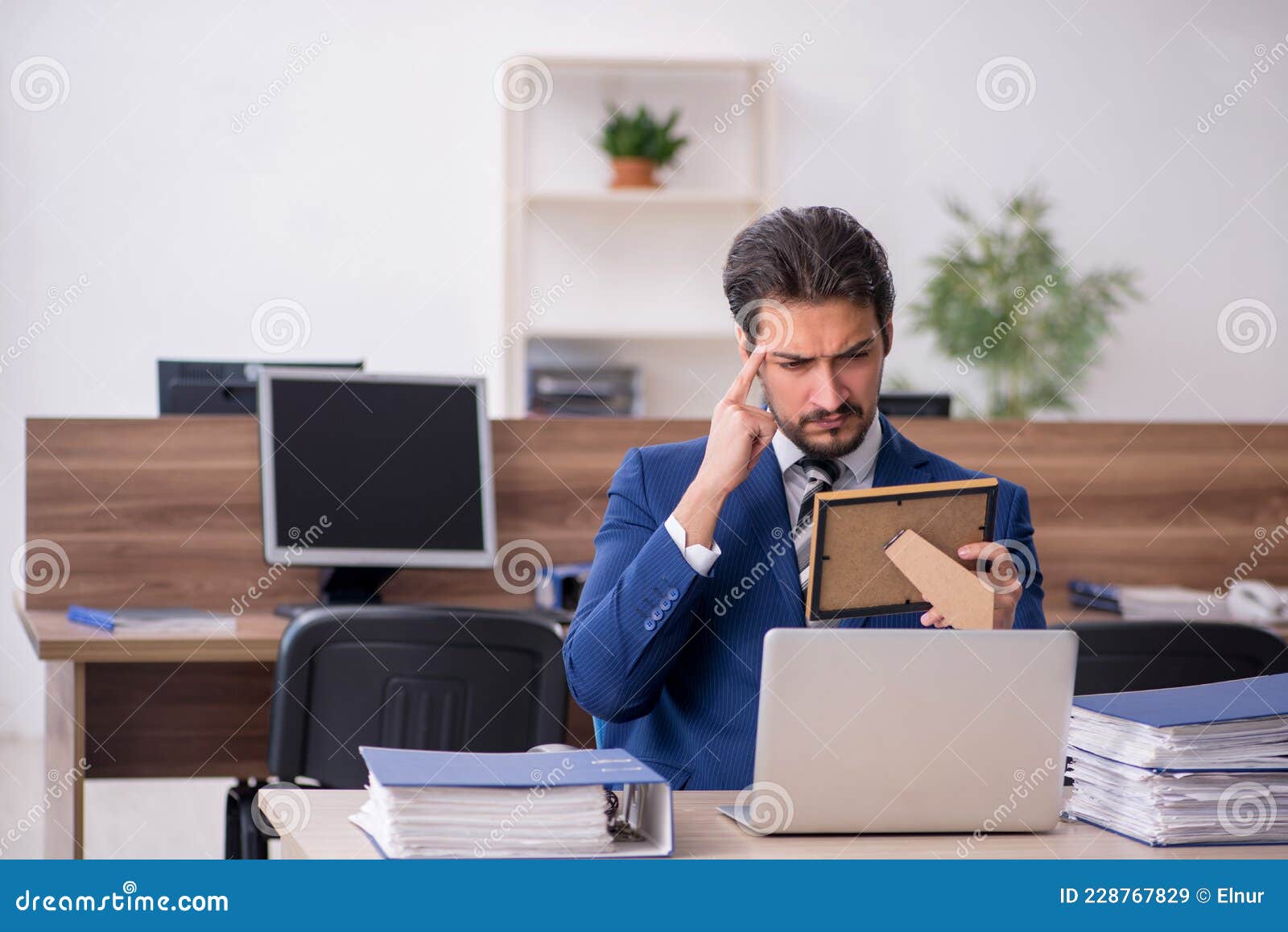 Young Male Employee Missing Girlfriend at Workplace Stock Image - Image ...
