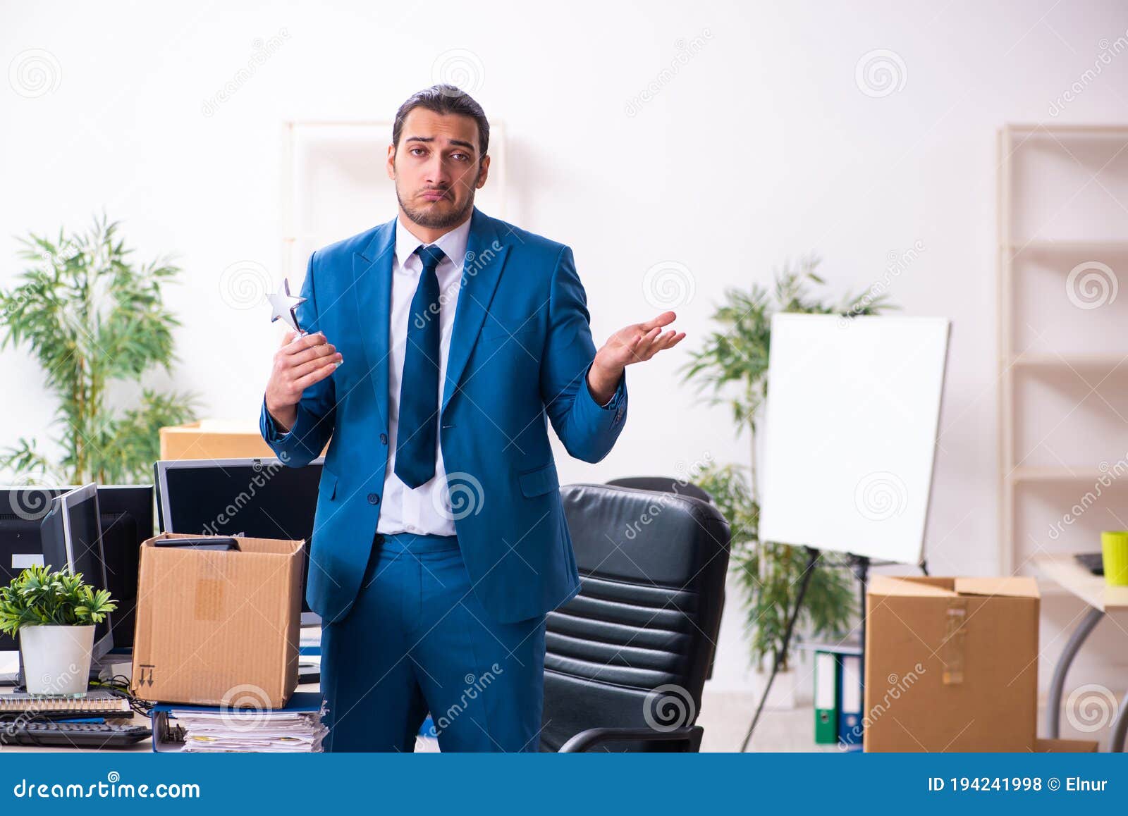 Young Male Employee in Moving Concept Stock Photo - Image of holding ...