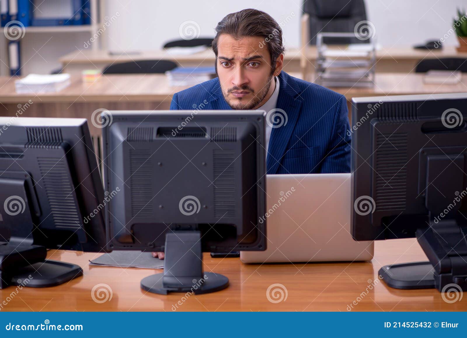 Young Male Employee in Multitasking Concept Stock Photo - Image of ...