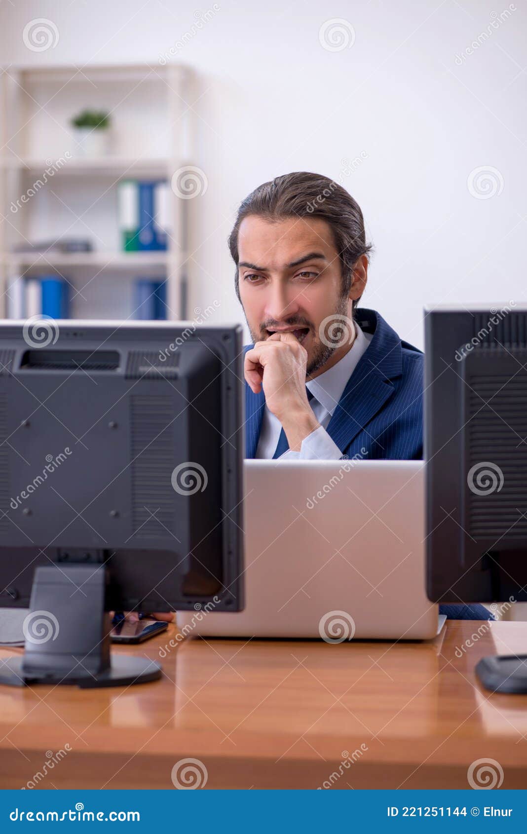 Young Male Employee in Multitasking Concept Stock Photo - Image of ...