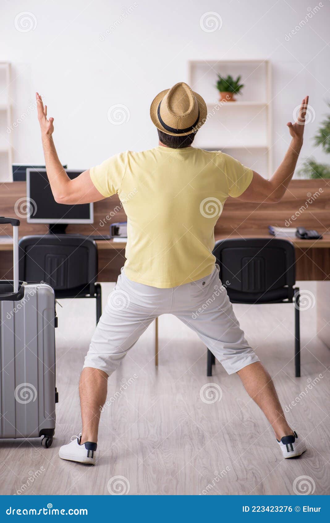 Young Male Employee Preparing for Trip at Workplace Stock Photo - Image ...
