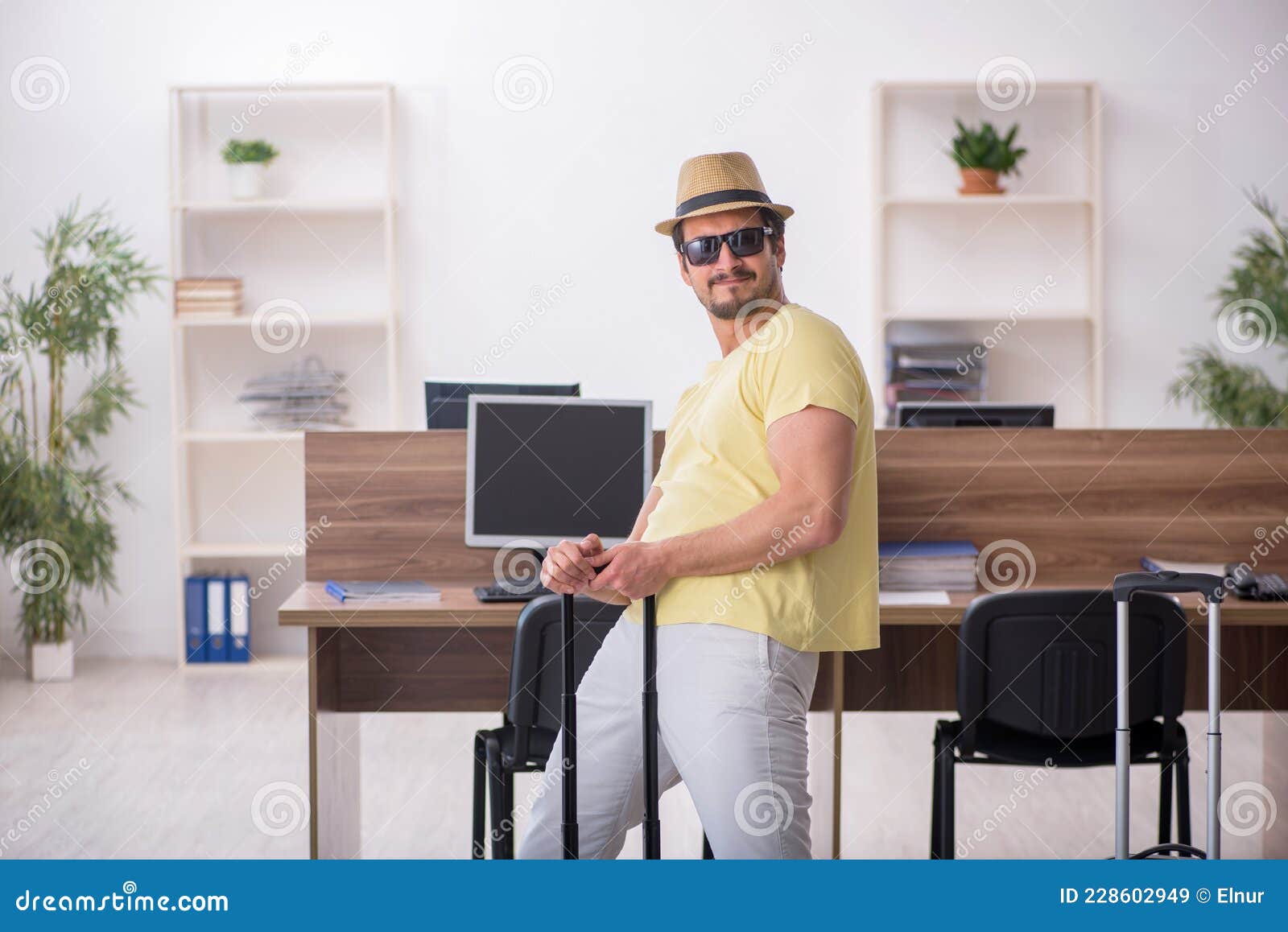 Young Male Employee Preparing for Trip at Workplace Stock Image - Image ...
