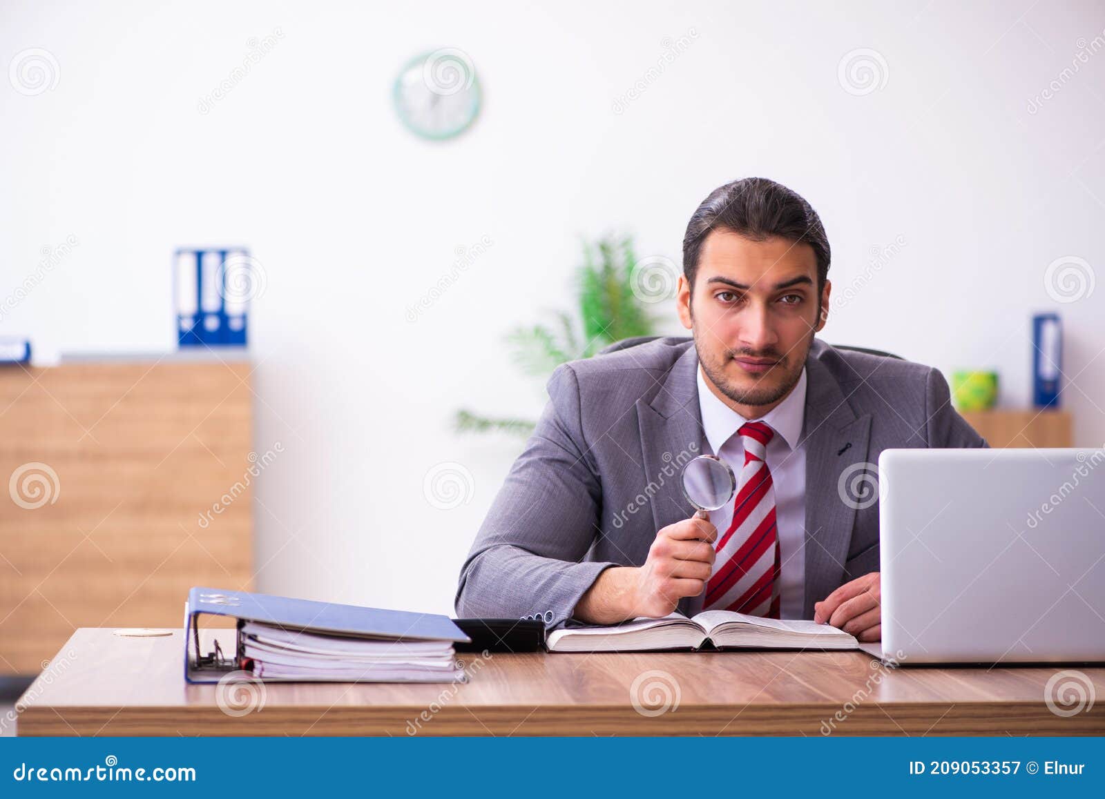 Young Male Employee Reading Book in the Office Stock Image - Image of ...