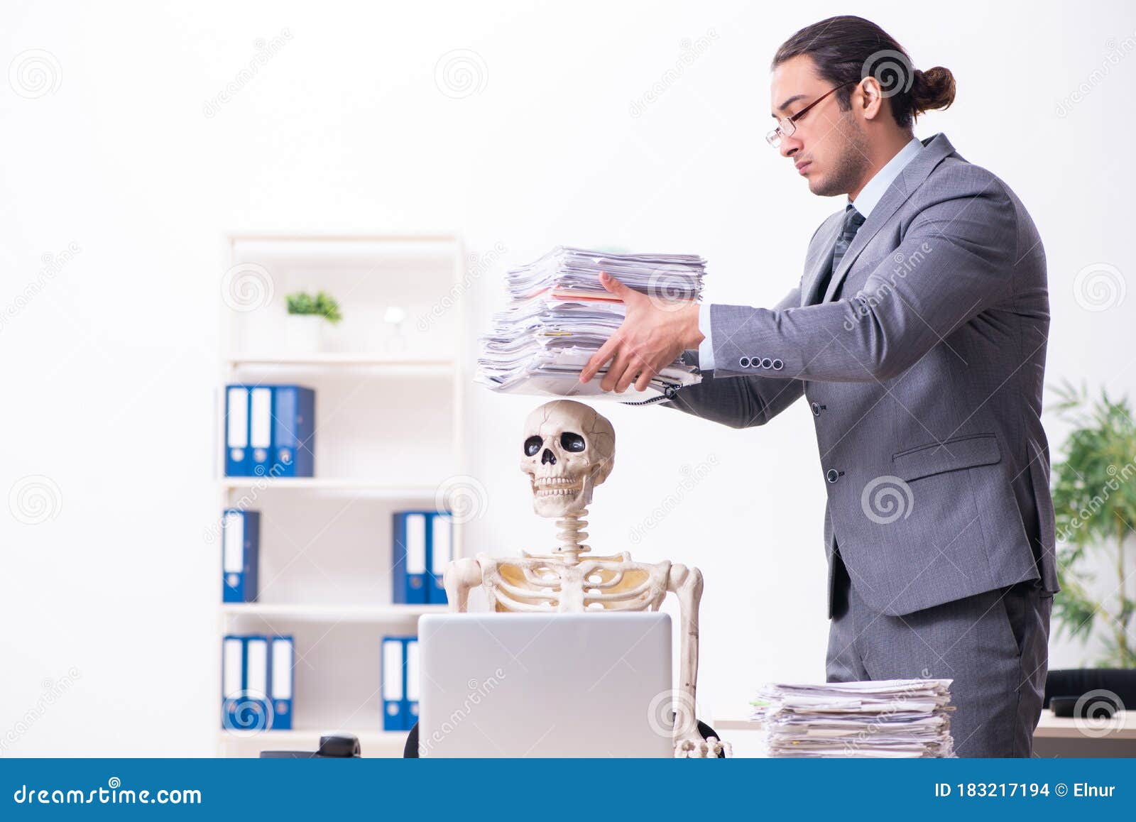 Young Male Employee and Skeleton in the Office Stock Photo - Image of ...