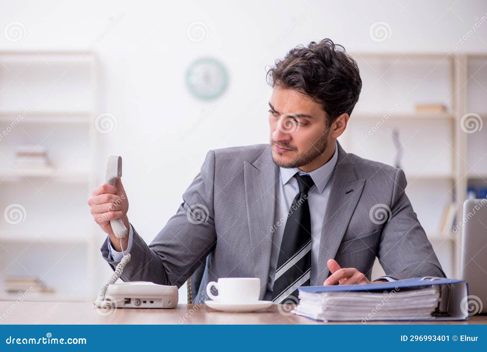 Young Male Employee Speaking by Phone Stock Image - Image of working ...