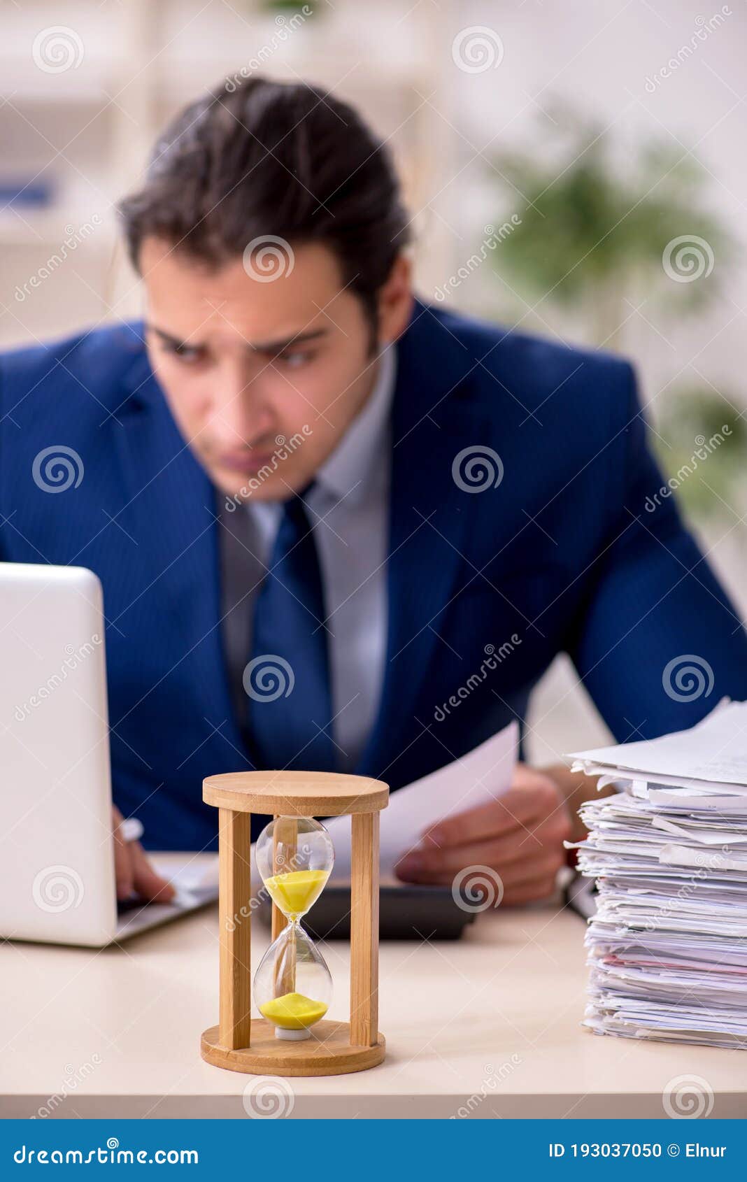 Young Male Employee in Time Management Concept Stock Photo - Image of ...