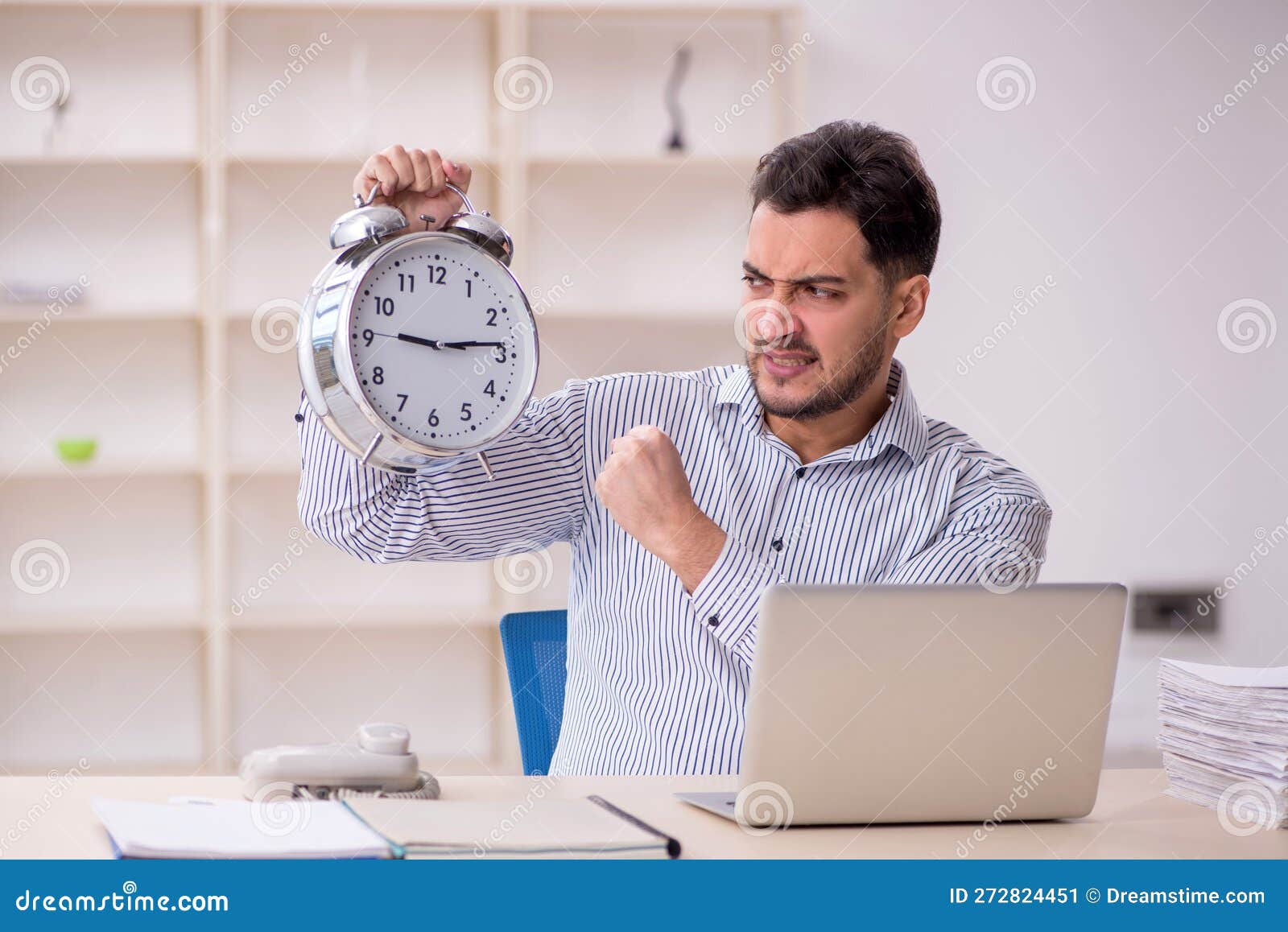 Young Male Employee in Time Management Concept Stock Image - Image of ...
