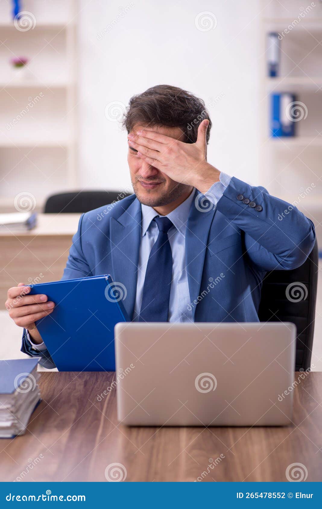 Young Male Employee and Too Much Work in the Office Stock Photo - Image ...
