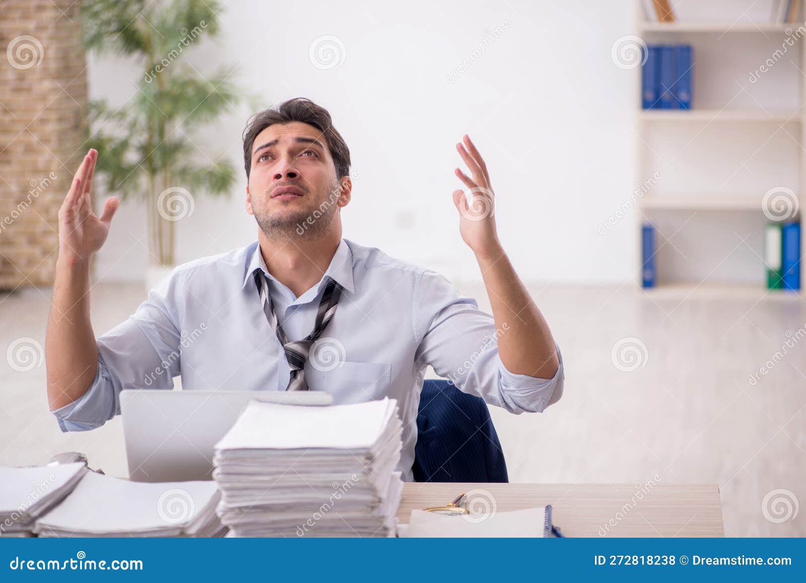 Young Male Employee and Too Much Work in the Office Stock Photo - Image ...
