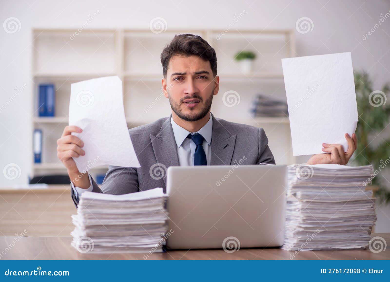 Young Male Employee and Too Much Work in the Office Stock Photo - Image ...