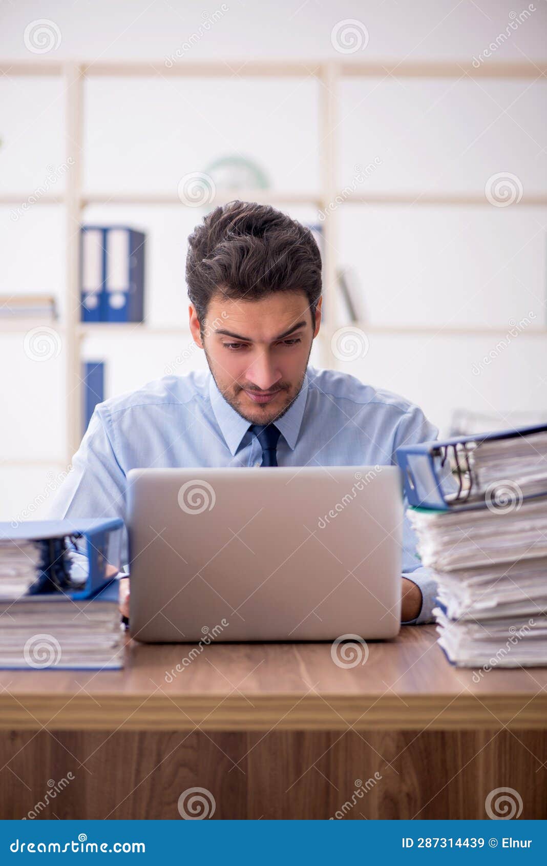 Young Male Employee and Too Much Work in the Office Stock Image - Image ...