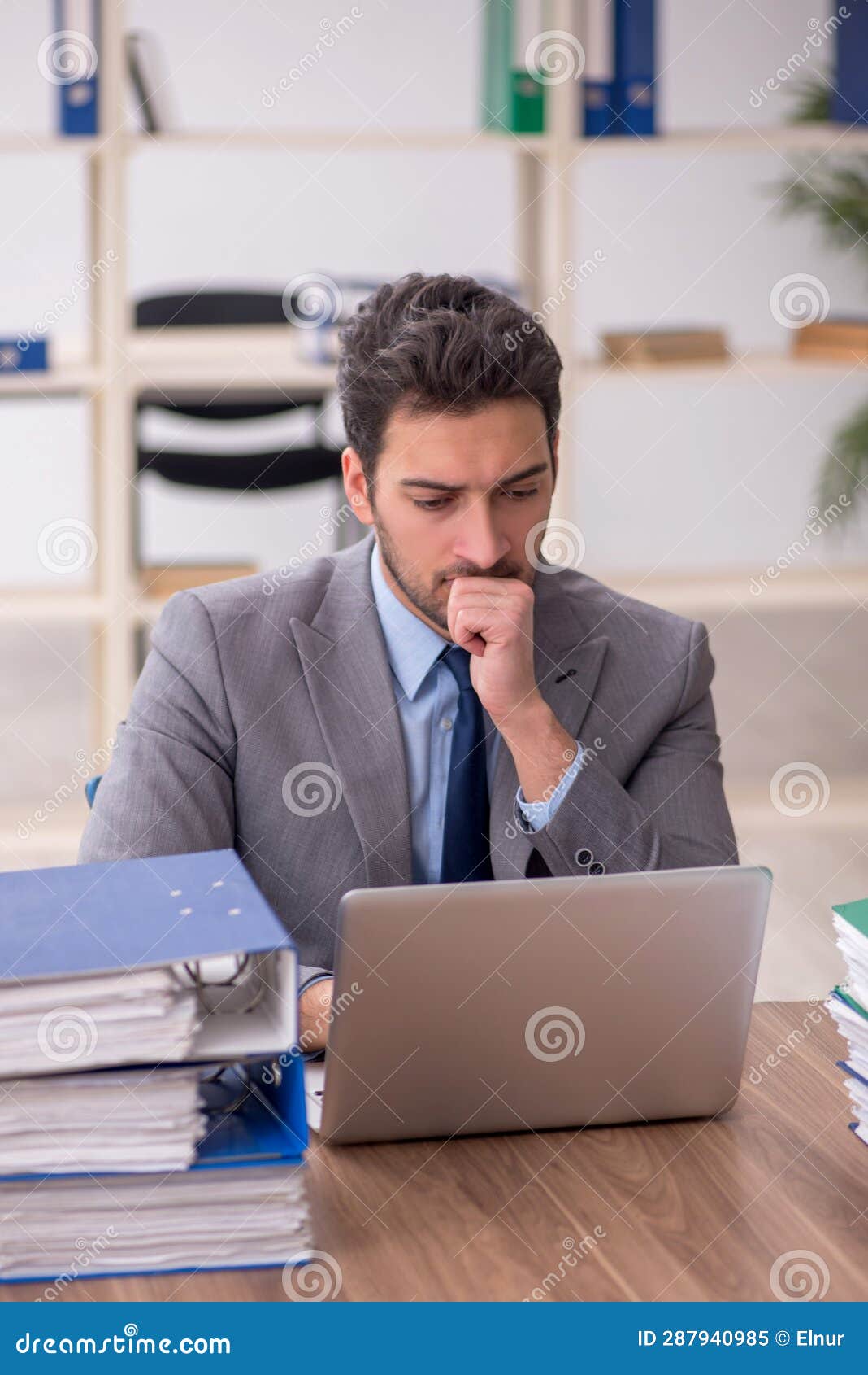 Young Male Employee and Too Much Work in the Office Stock Image - Image ...