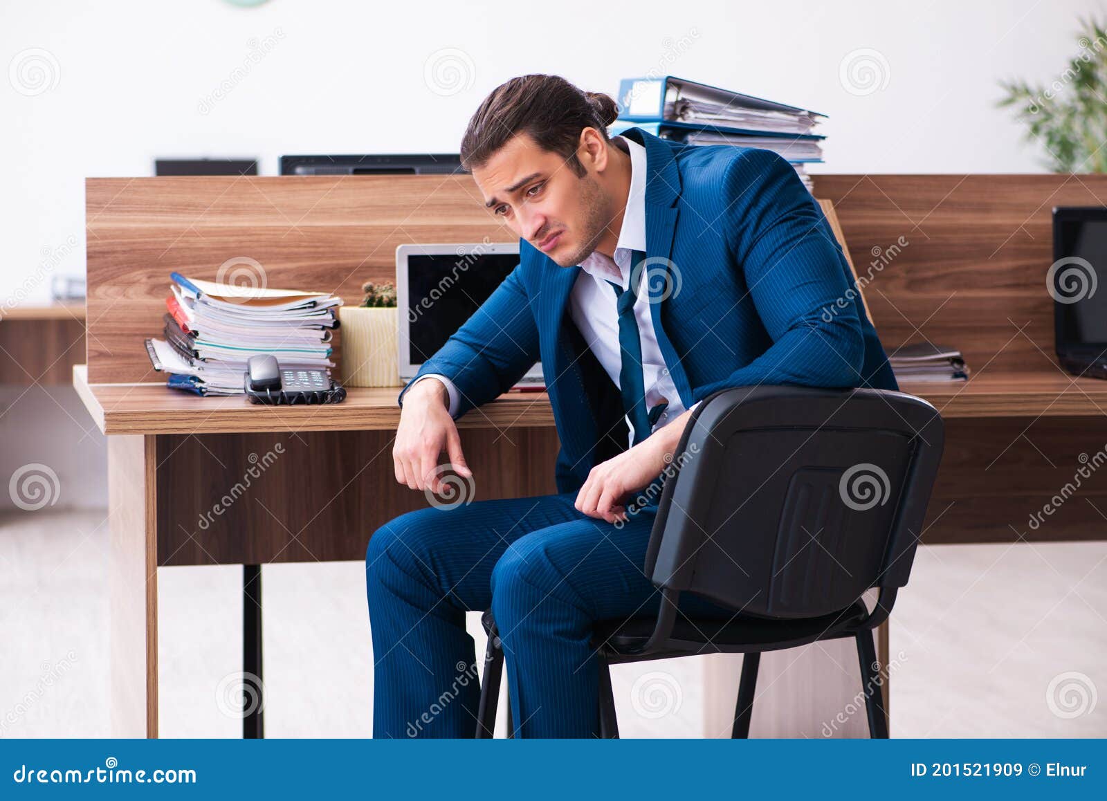 Young Male Employee Unhappy with Excessive Work in the Office Stock ...