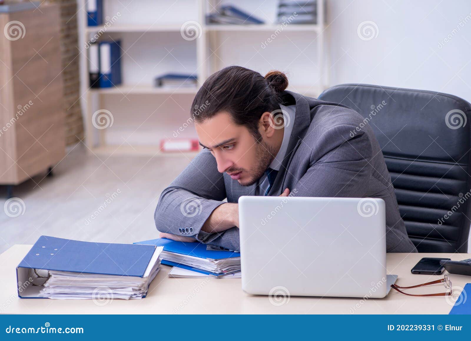 Young Male Employee Unhappy with Excessive Work in the Office Stock ...