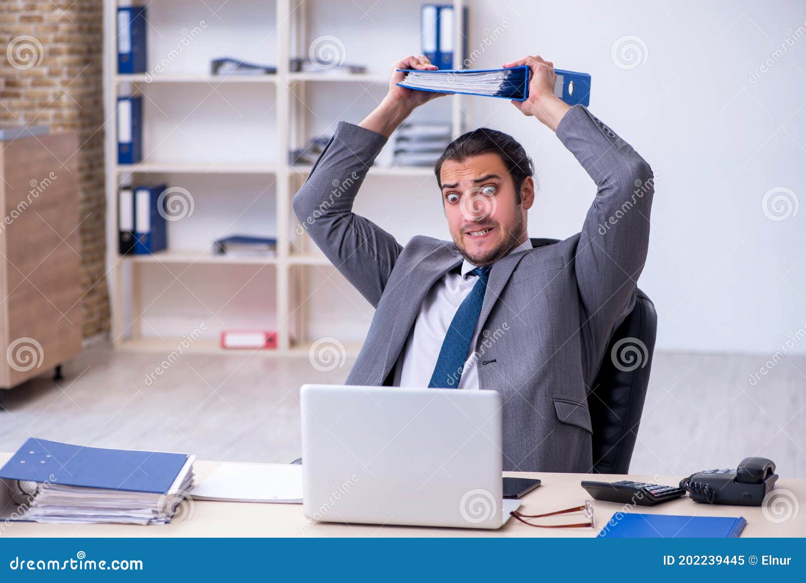 Young Male Employee Unhappy with Excessive Work in the Office Stock ...