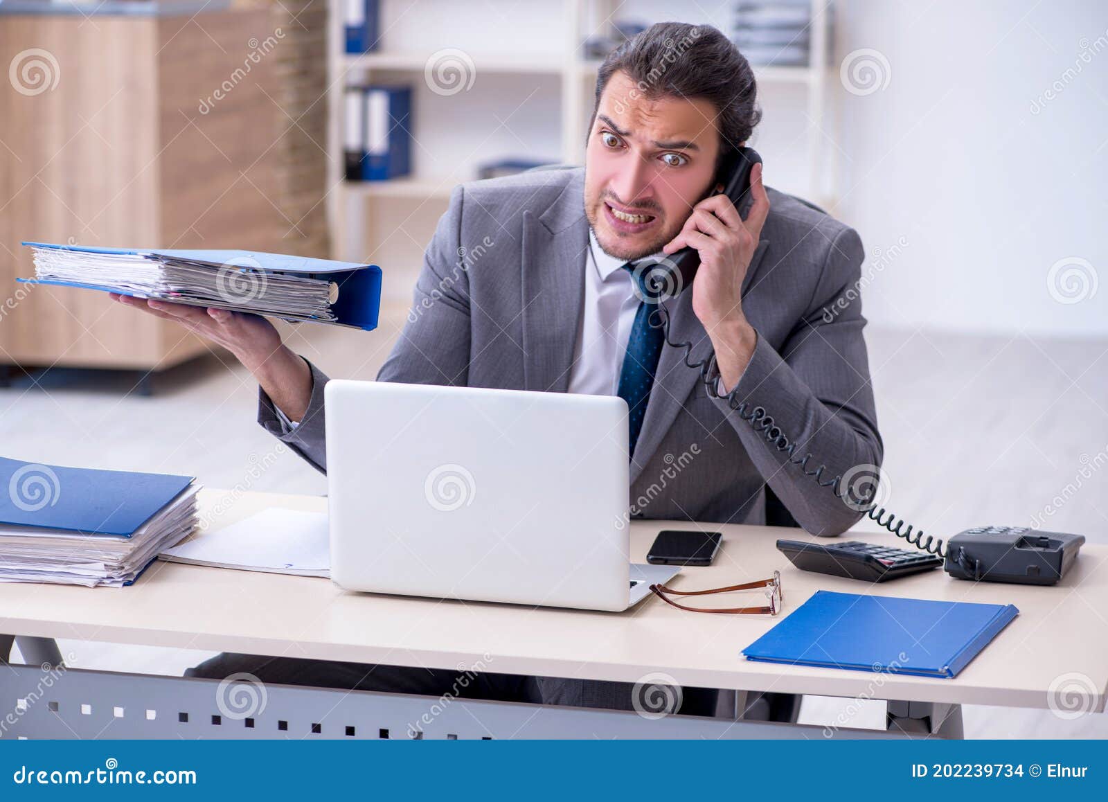 Young Male Employee Unhappy with Excessive Work in the Office Stock ...