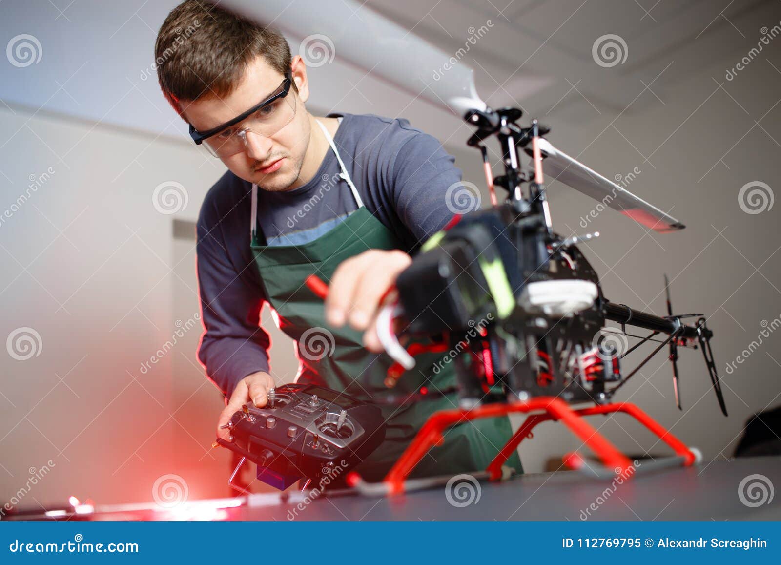 Young Male Engineer or Technician with Remote Control in His Hands ...