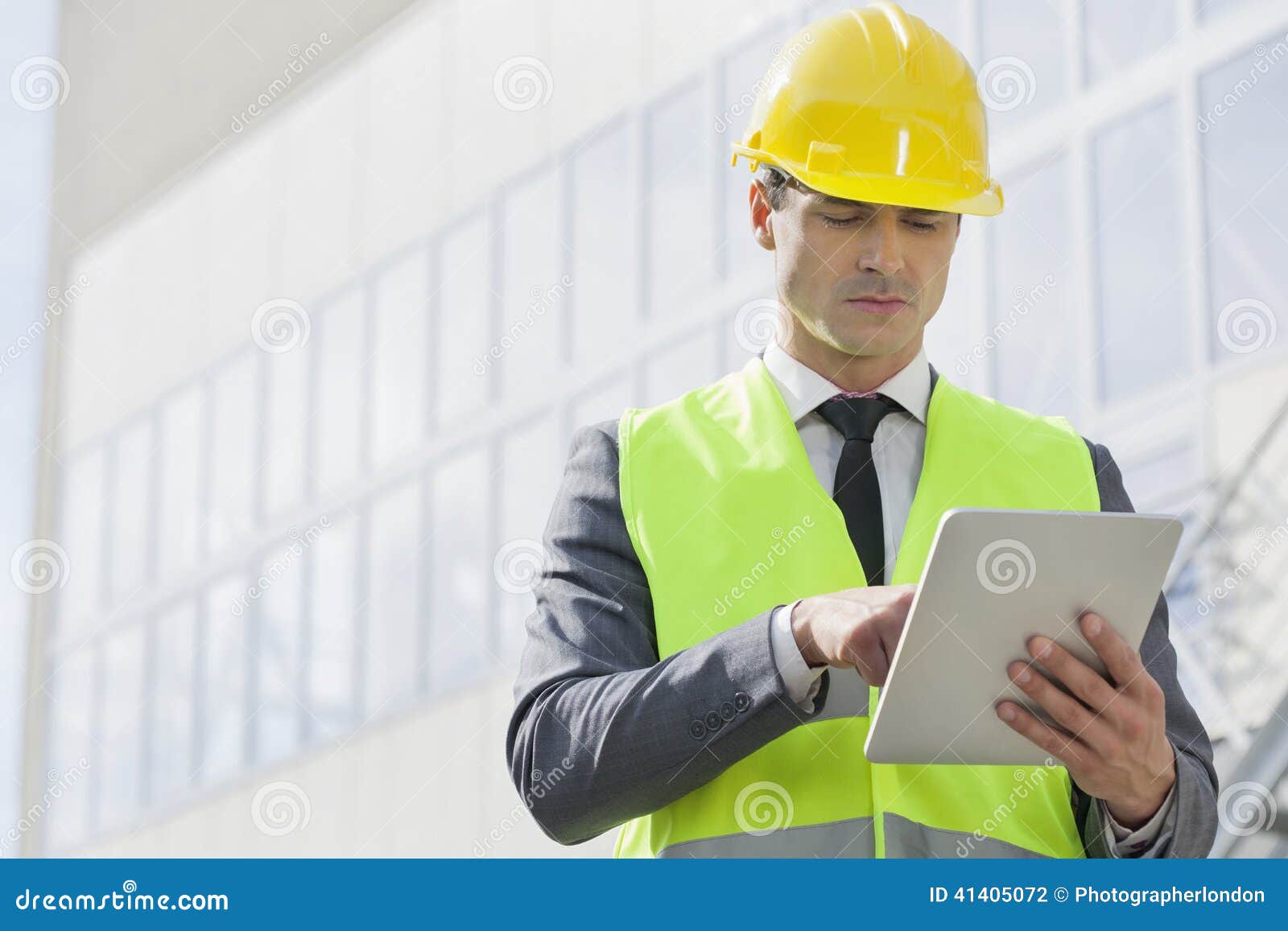 Young Male Engineer Using Digital Tablet Outside Industry Stock Photo ...