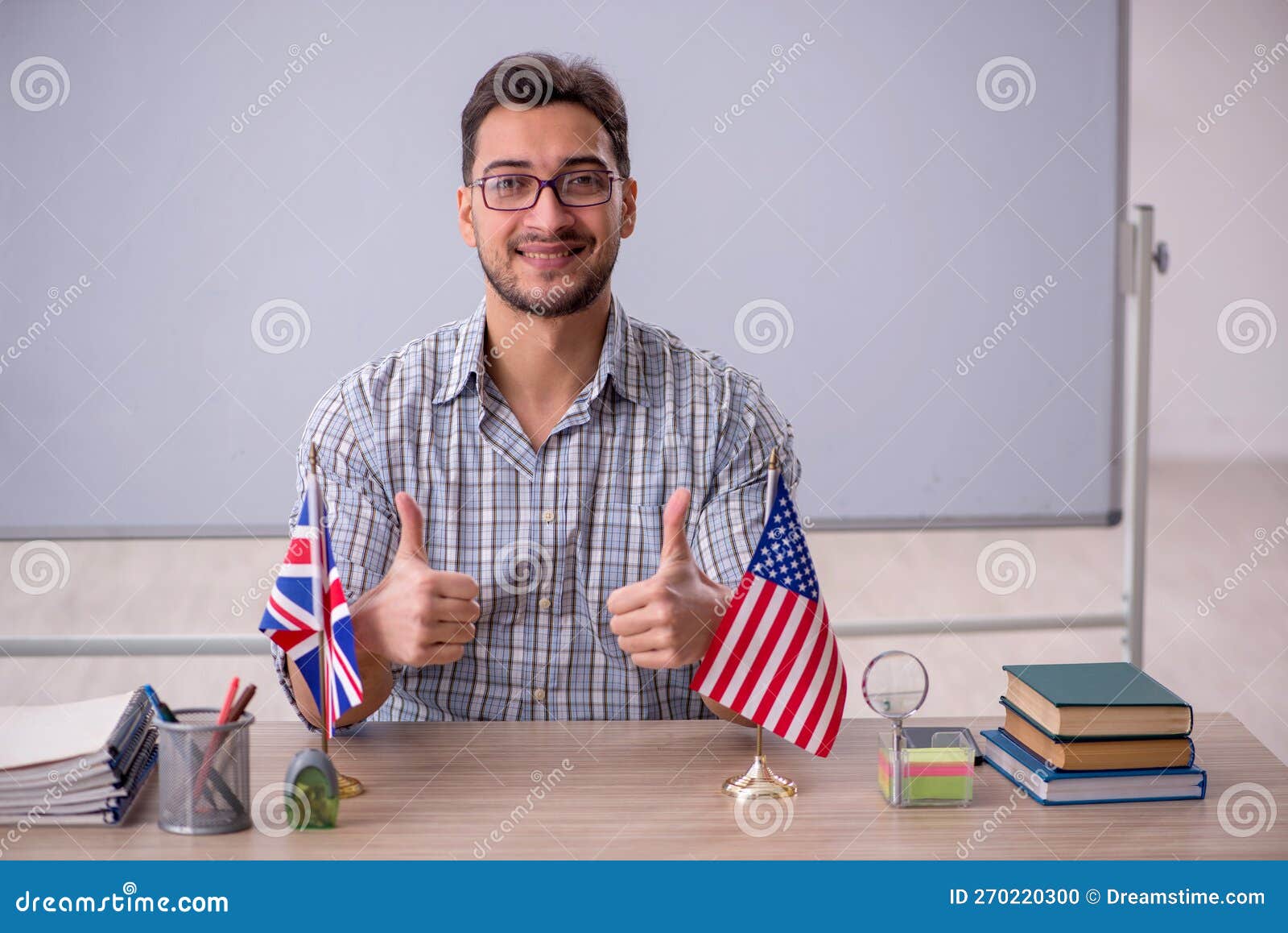 Young Male English Language Teacher in the Classroom Stock Photo ...