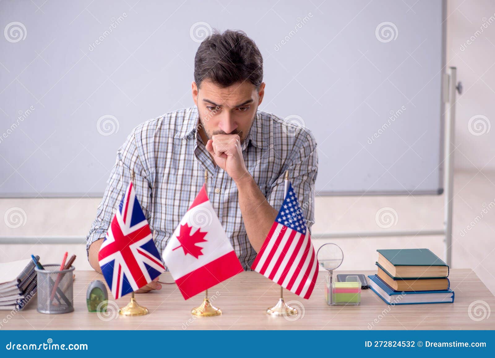 Young Male English Language Teacher in the Classroom Stock Photo ...