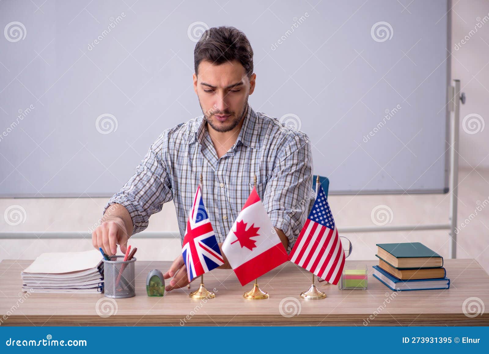 Young Male English Language Teacher in the Classroom Stock Image ...
