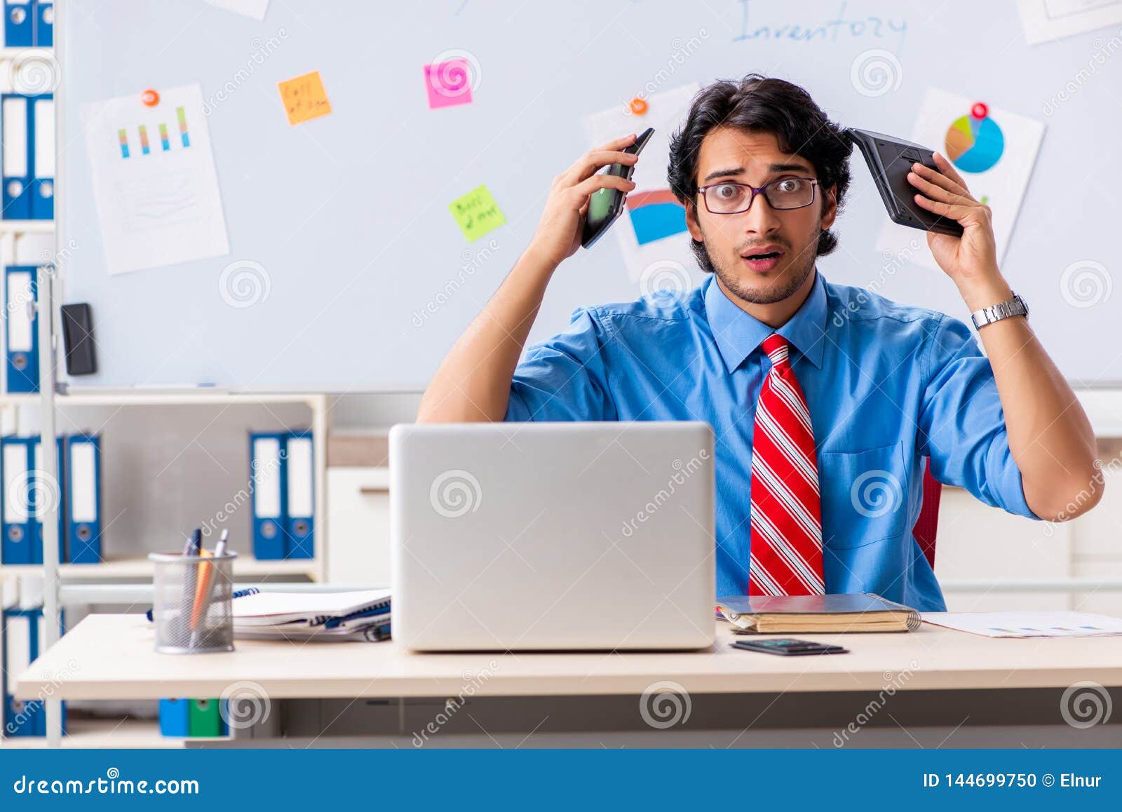 The Young Male Financial Manager Working in the Office Stock Photo ...
