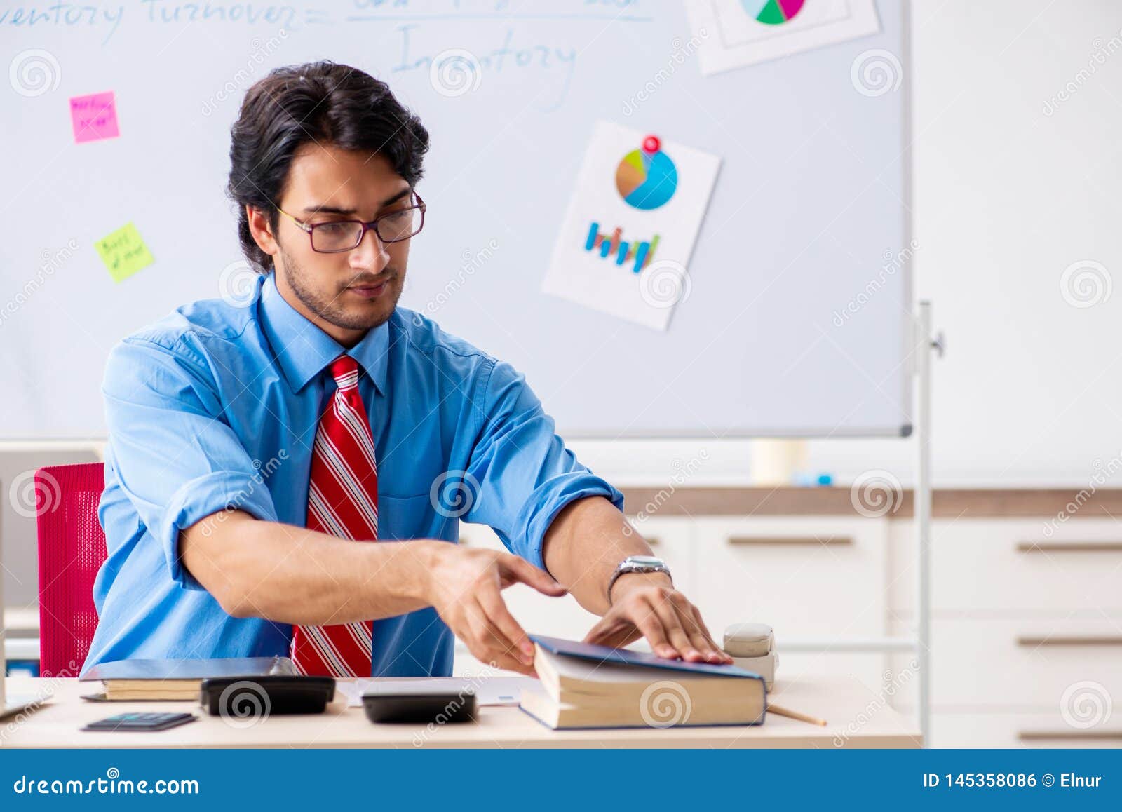 The Young Male Financial Manager Working in the Office Stock Photo ...