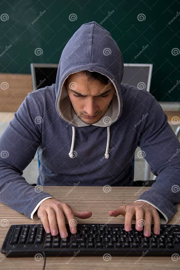 Young Male Hacker Sitting in the Classroom Stock Photo - Image of class ...