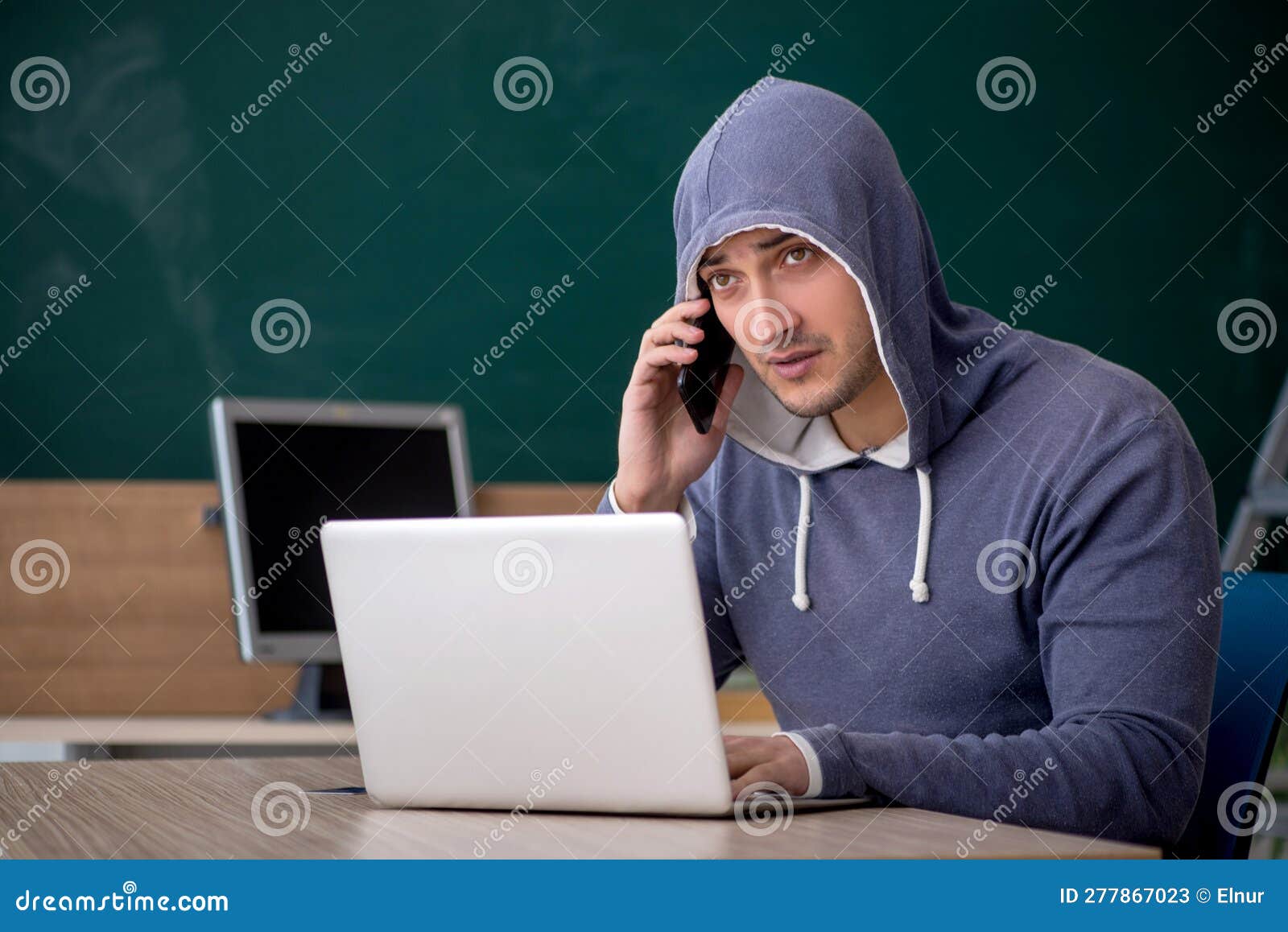 Young Male Hacker Sitting in the Classroom Stock Image - Image of ...