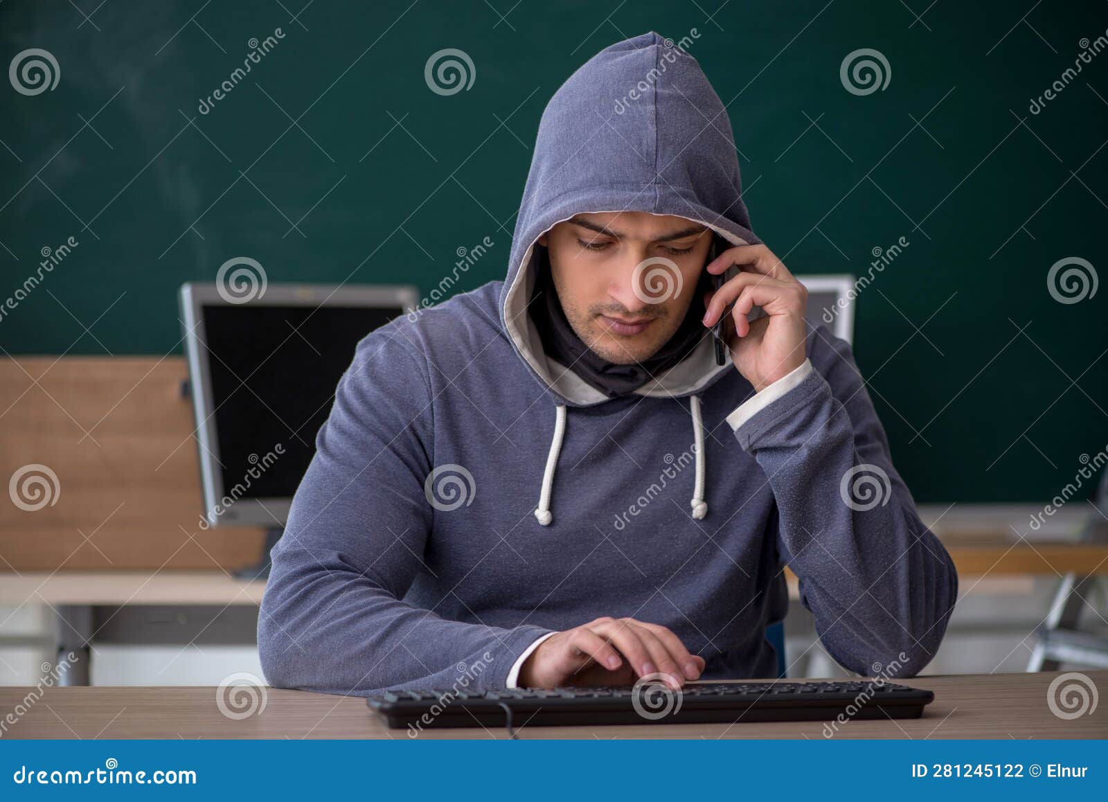 Young Male Hacker Sitting in the Classroom Stock Photo - Image of ...