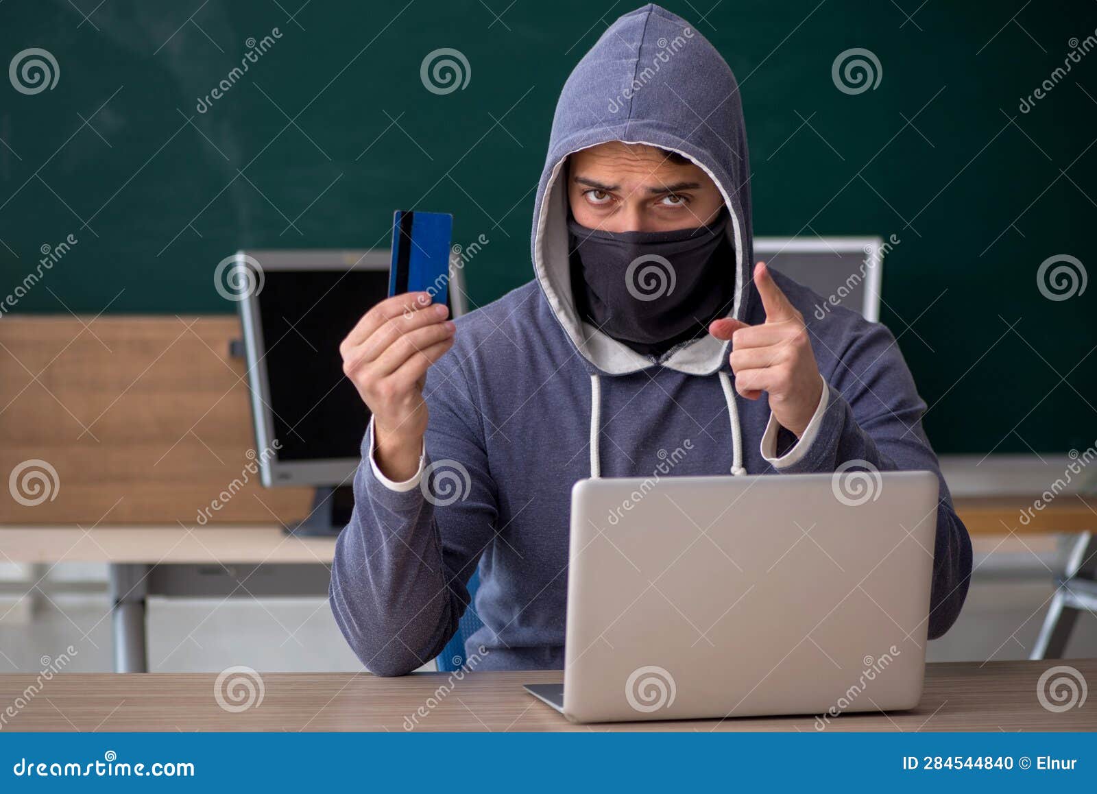 Young Male Hacker Sitting in the Classroom Stock Photo - Image of ...
