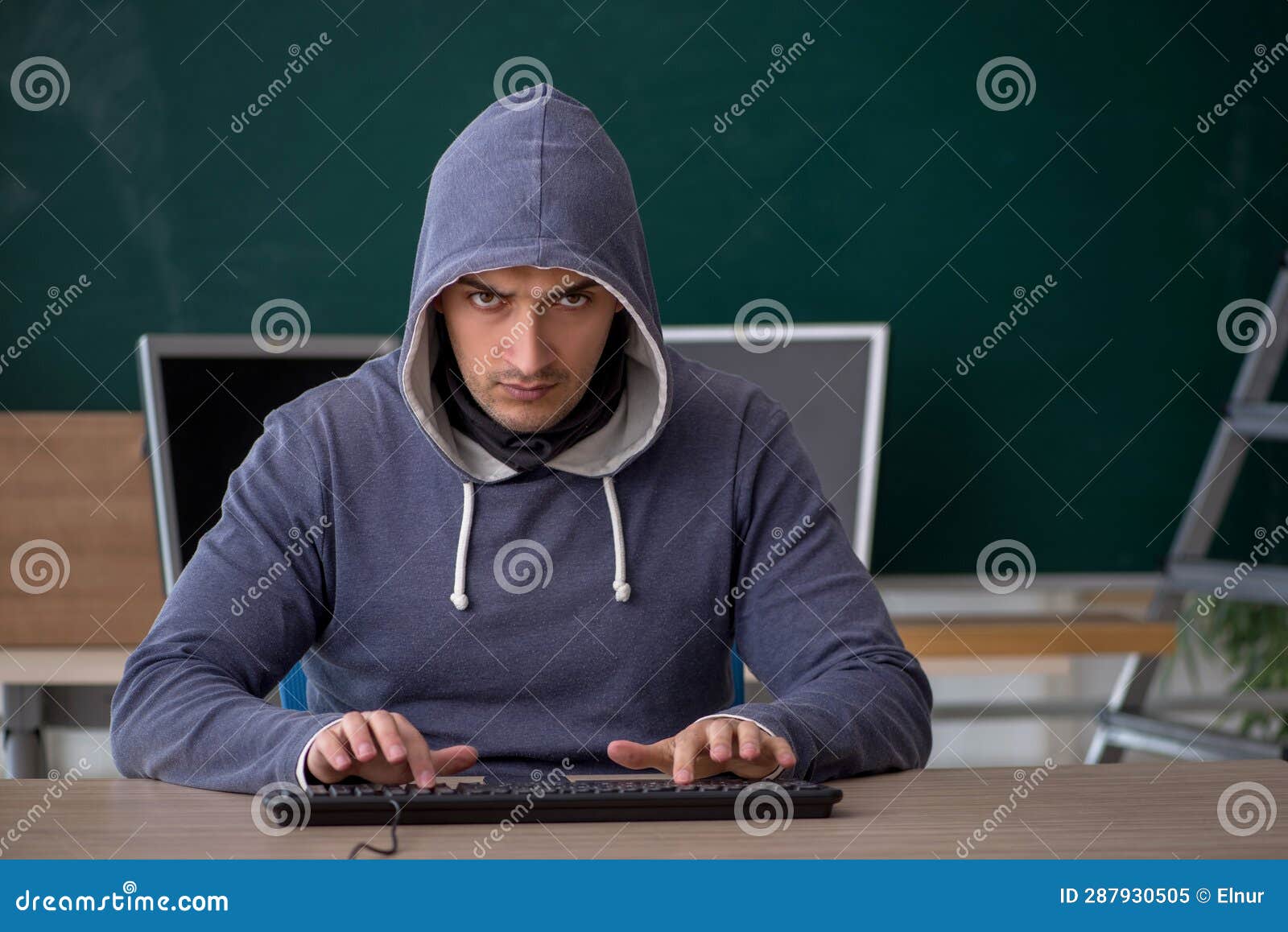 Young Male Hacker Sitting in the Classroom Stock Image - Image of ...