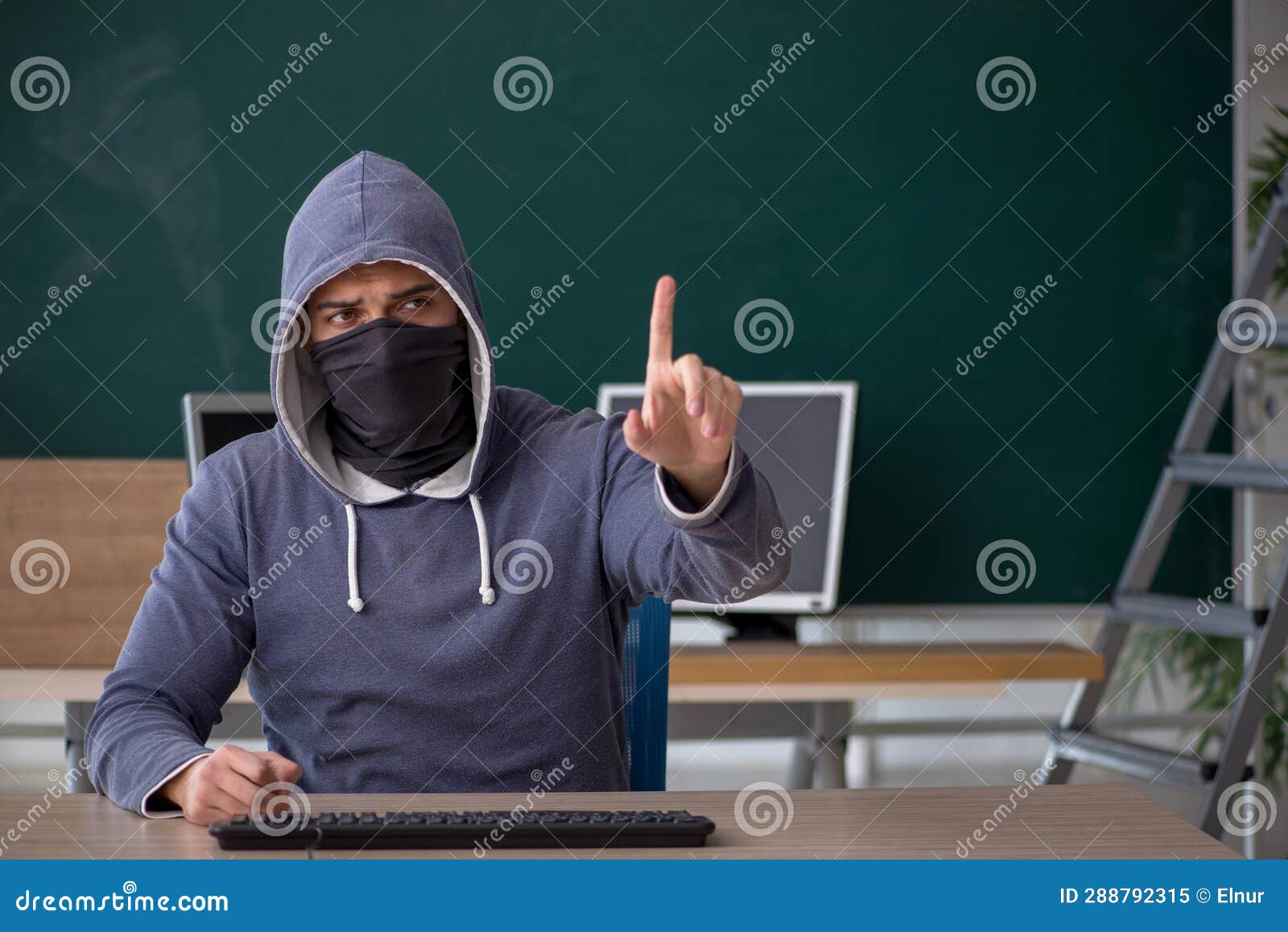 Young Male Hacker Sitting in the Classroom Stock Image - Image of mask ...