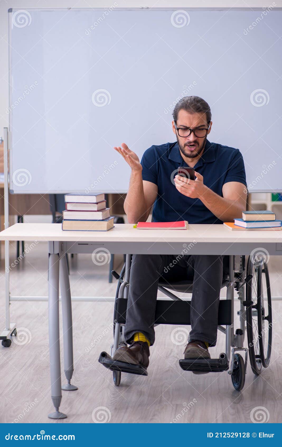 Young Male Handicapped Student in the Classroom Stock Photo - Image of ...