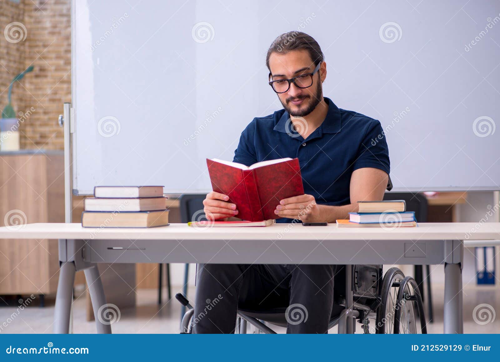 Young Male Handicapped Student in the Classroom Stock Image - Image of ...
