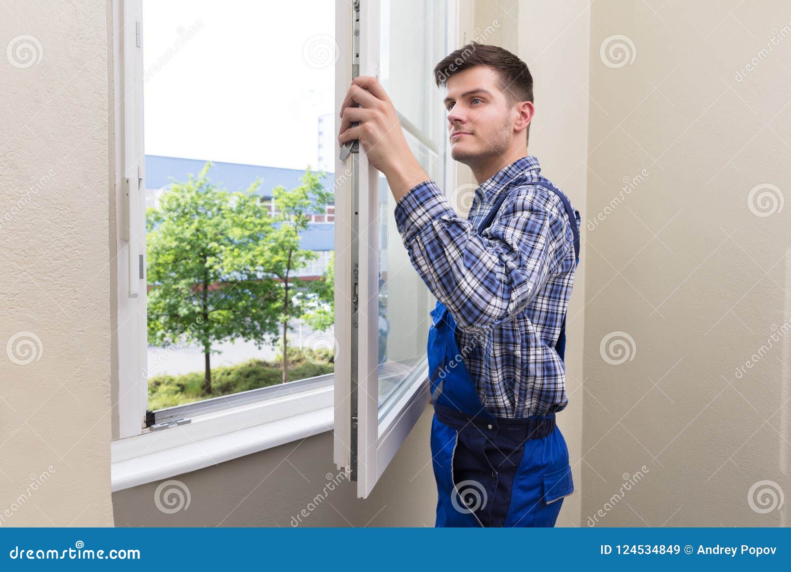 Handyman Installing Window stock image. Image of renovate - 124534849