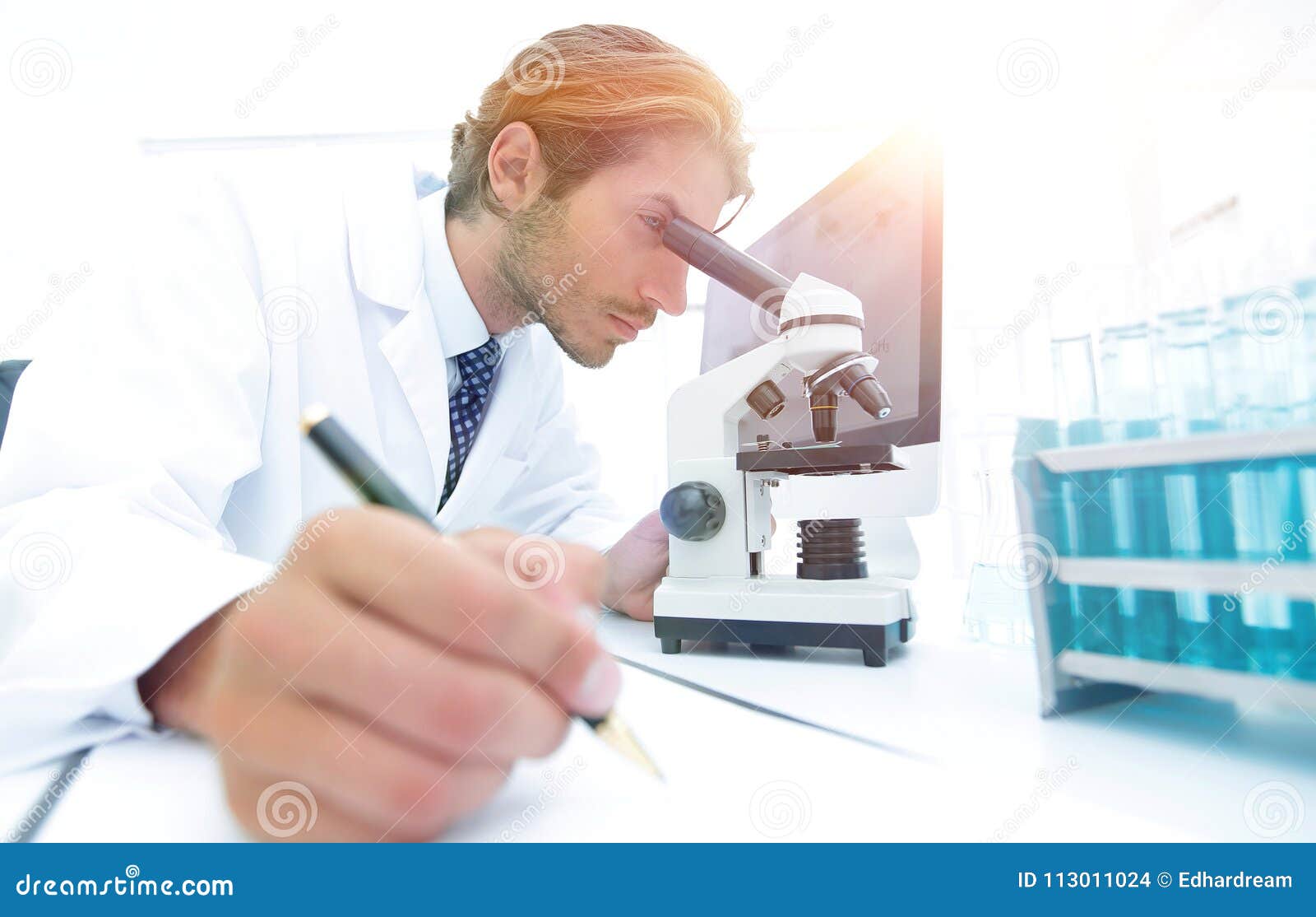 Scientist Makes a Note of Experiment in the Laboratory Stock Photo ...