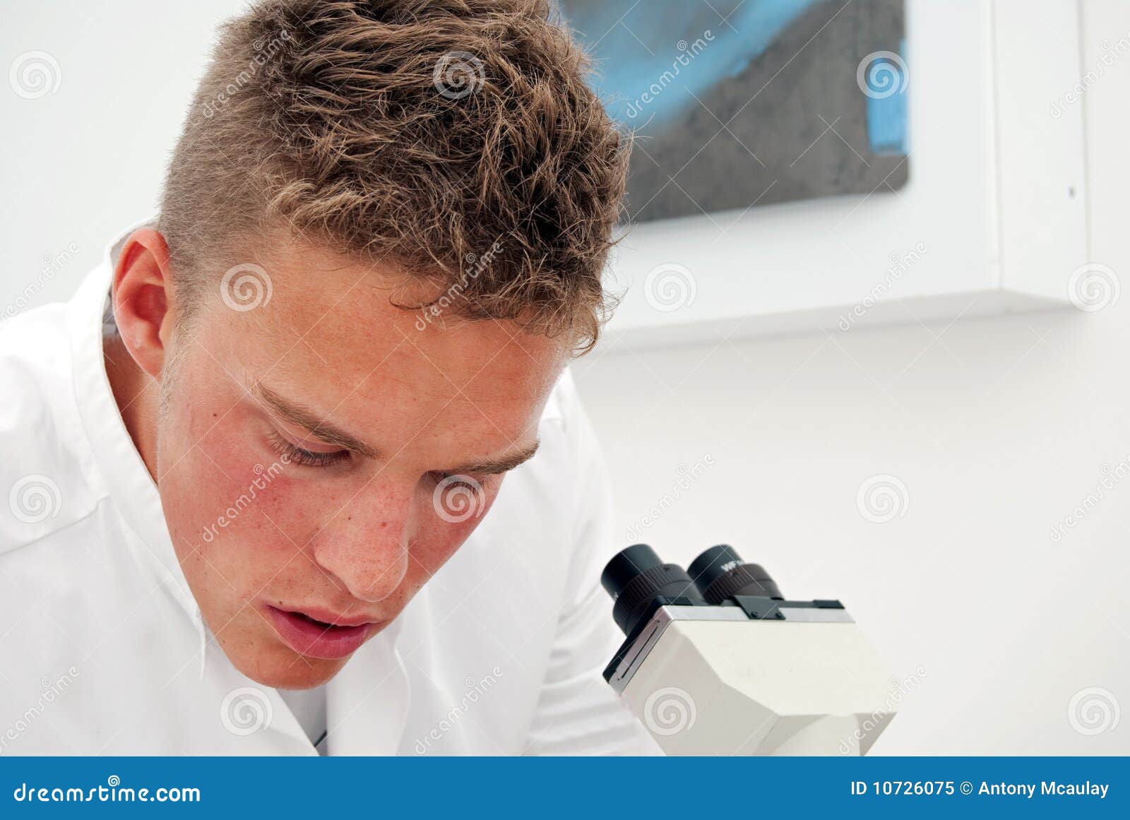 Young Male Lab Technician Looks at Results Stock Image - Image of body ...