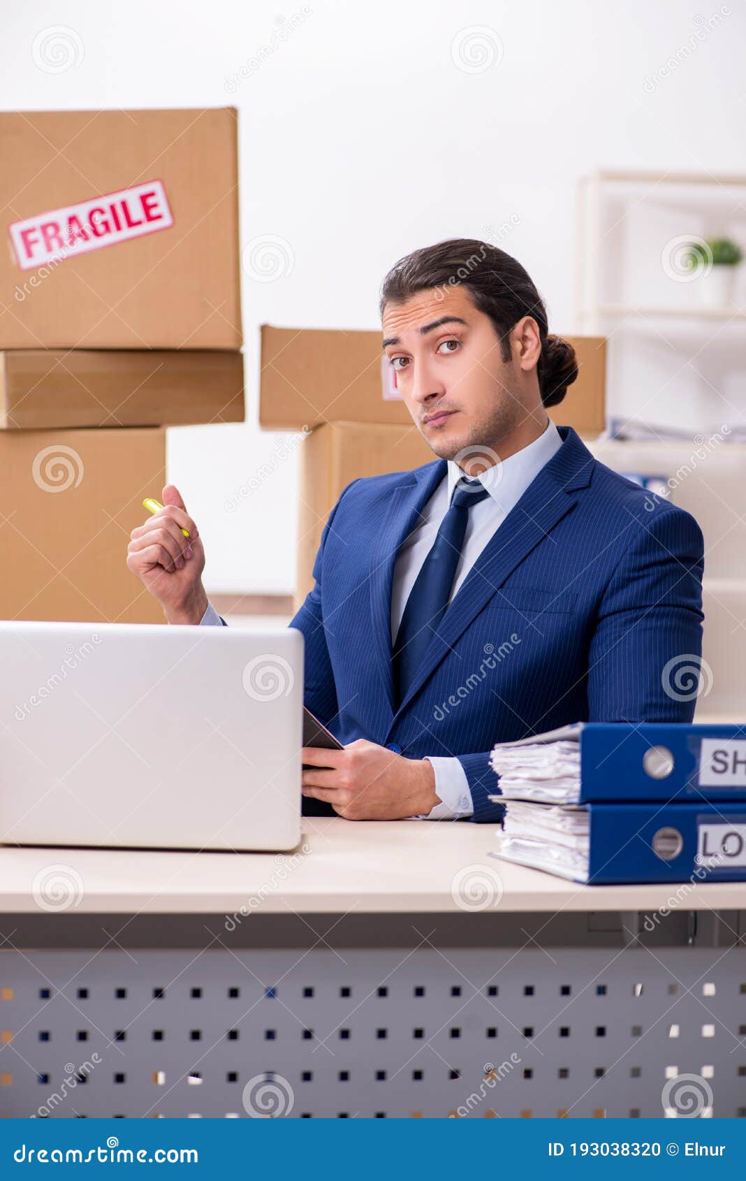 Young Male Logistics Specialist Working in the Office Stock Photo ...