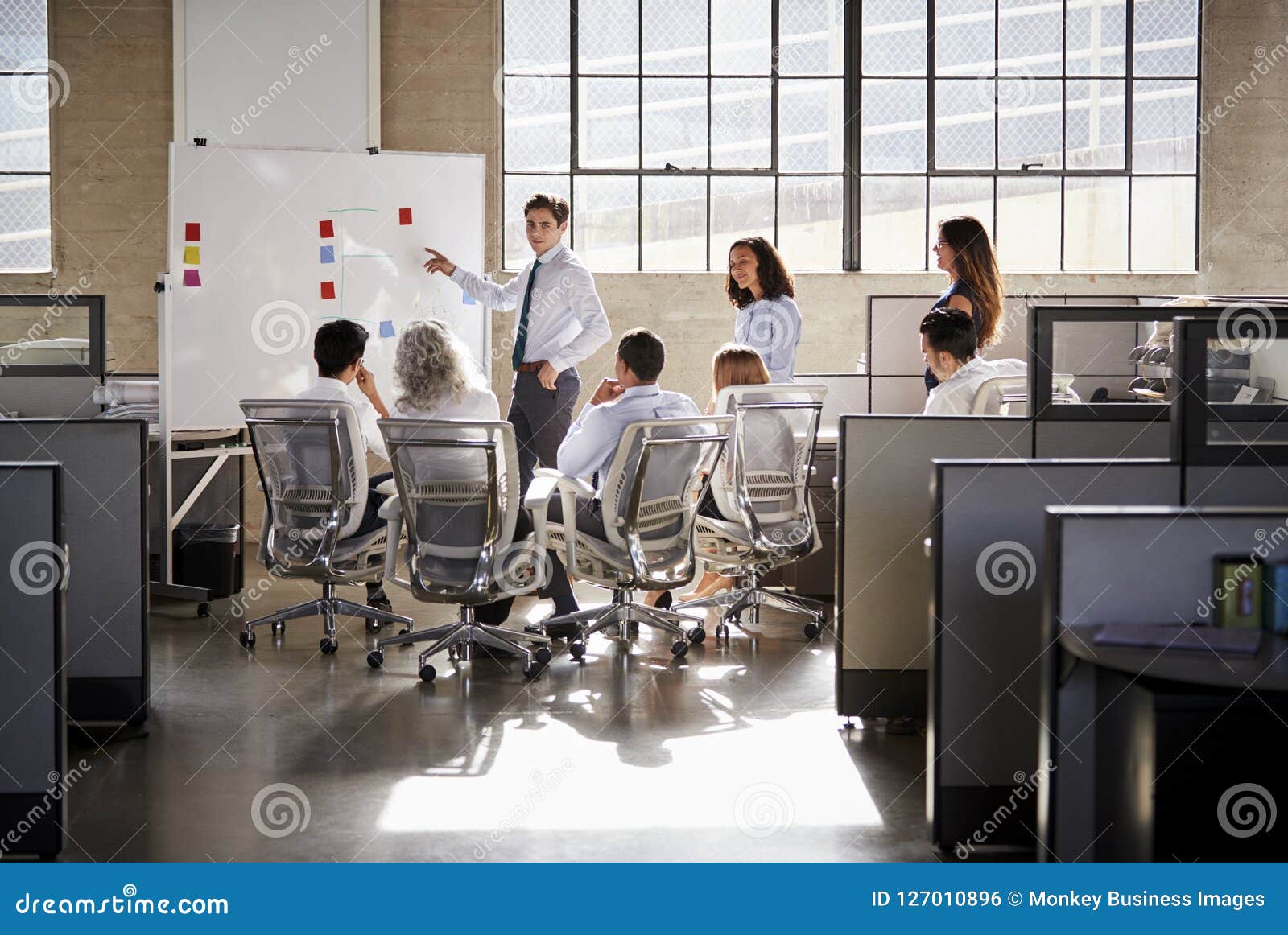 Young Male Manager Using Whiteboard in a Business Meeting Stock Photo ...