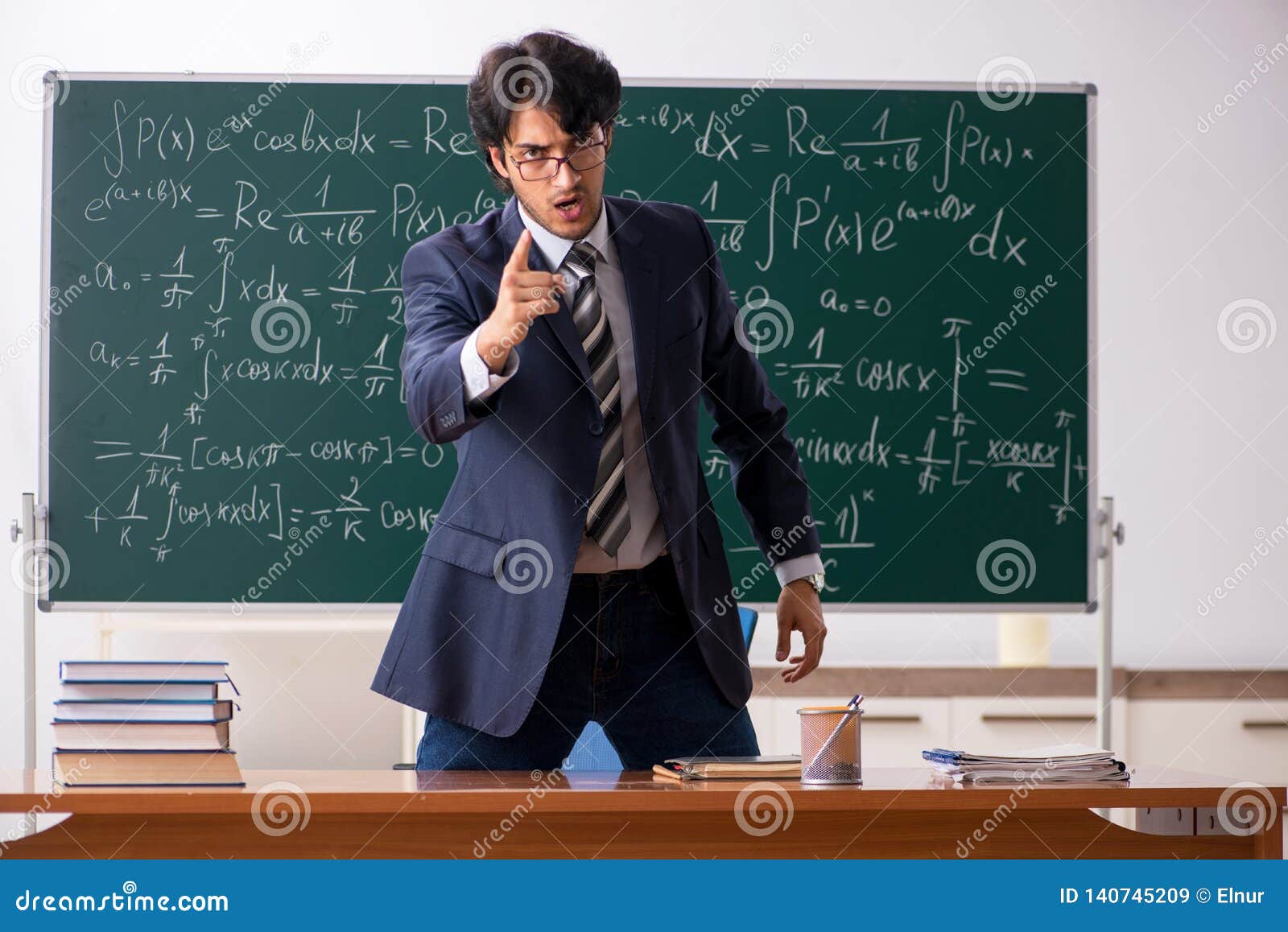 The Young Male Math Teacher in Classroom Stock Image - Image of class ... The Young Male Math Teacher in Classroom Stock Image - Image of class ...